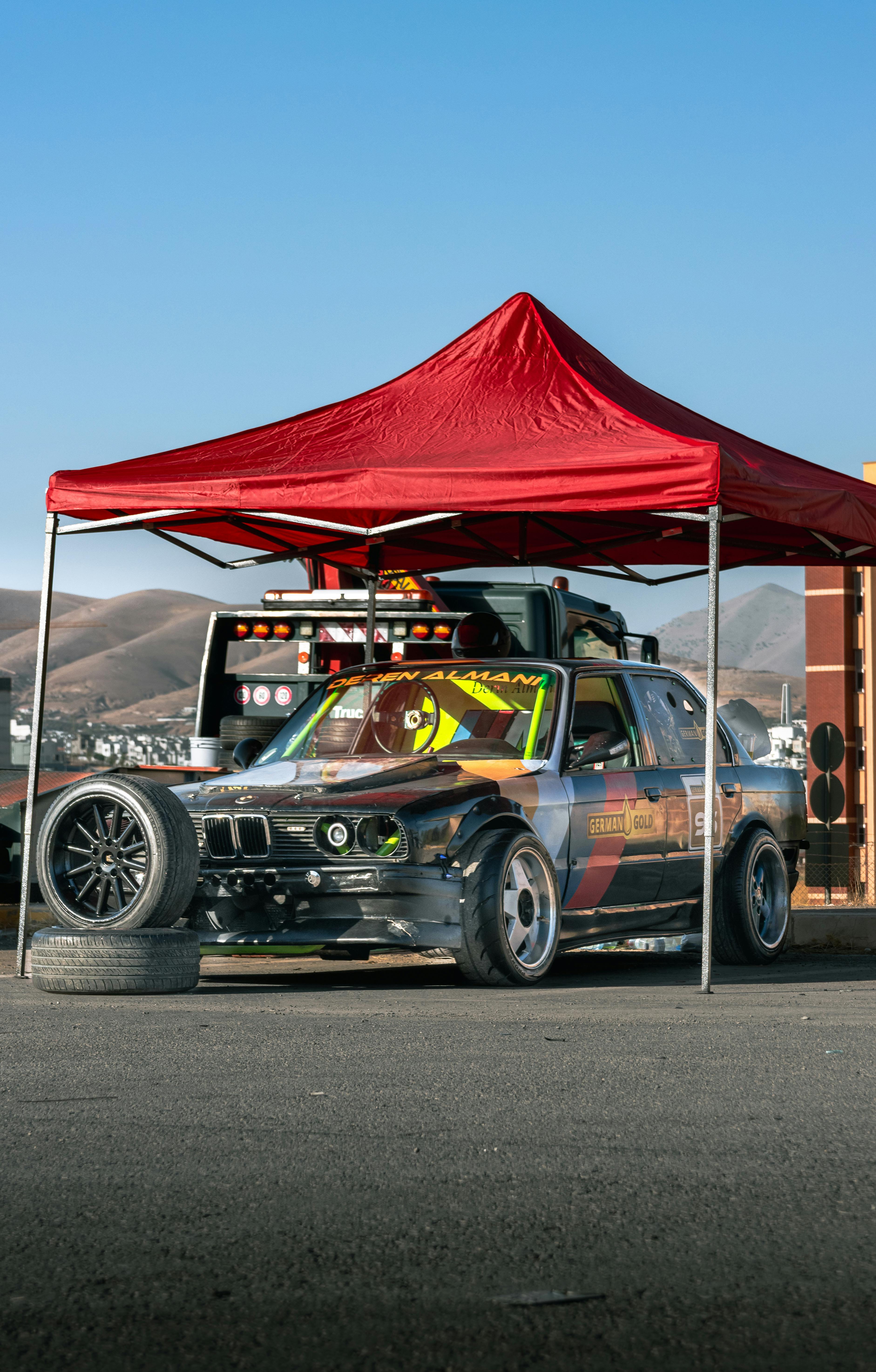 Custom Drift Car in Racing Set-Up under Tent · Free Stock Photo