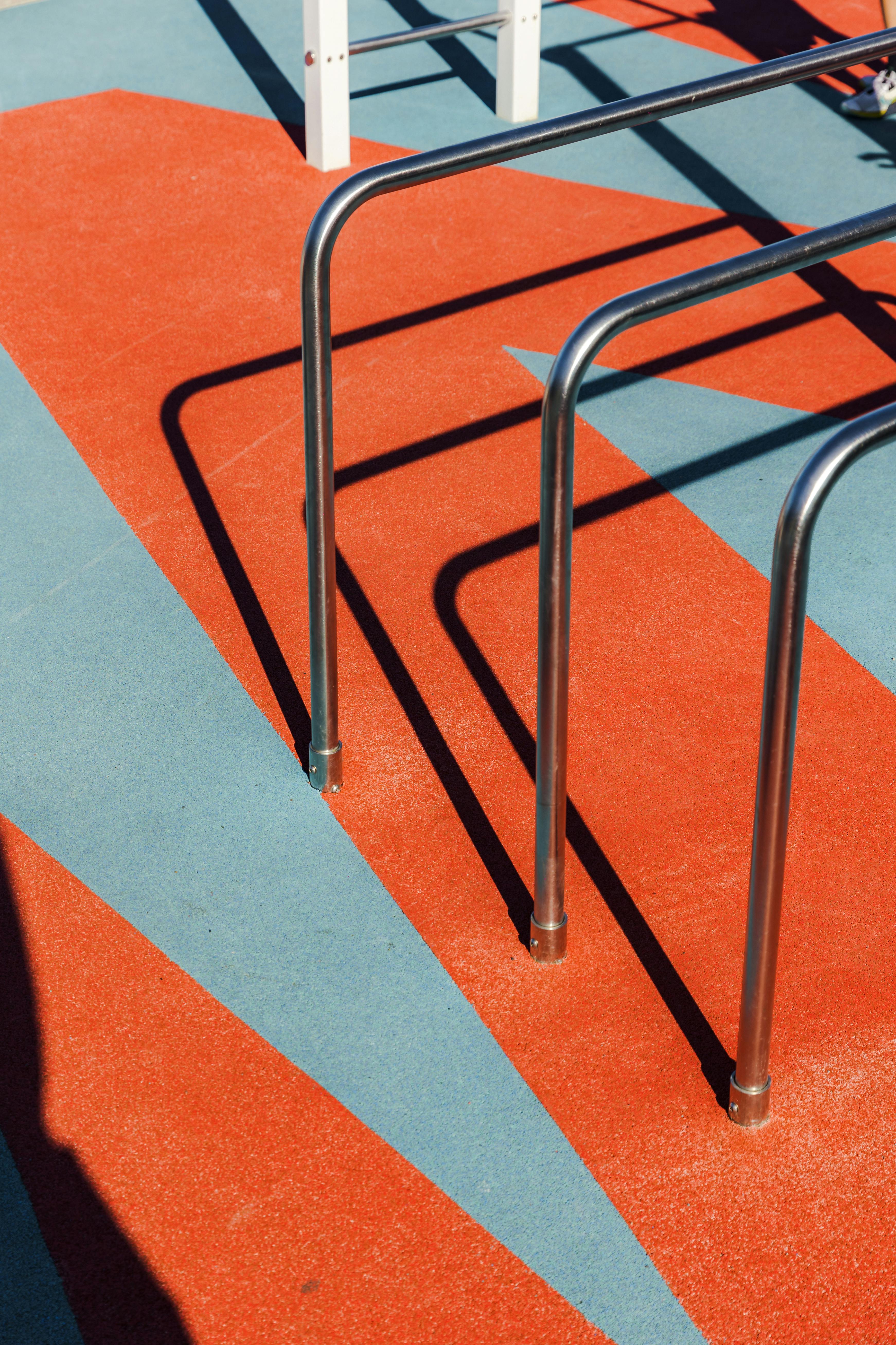 Colorful Outdoor Exercise Area with Bars · Free Stock Photo