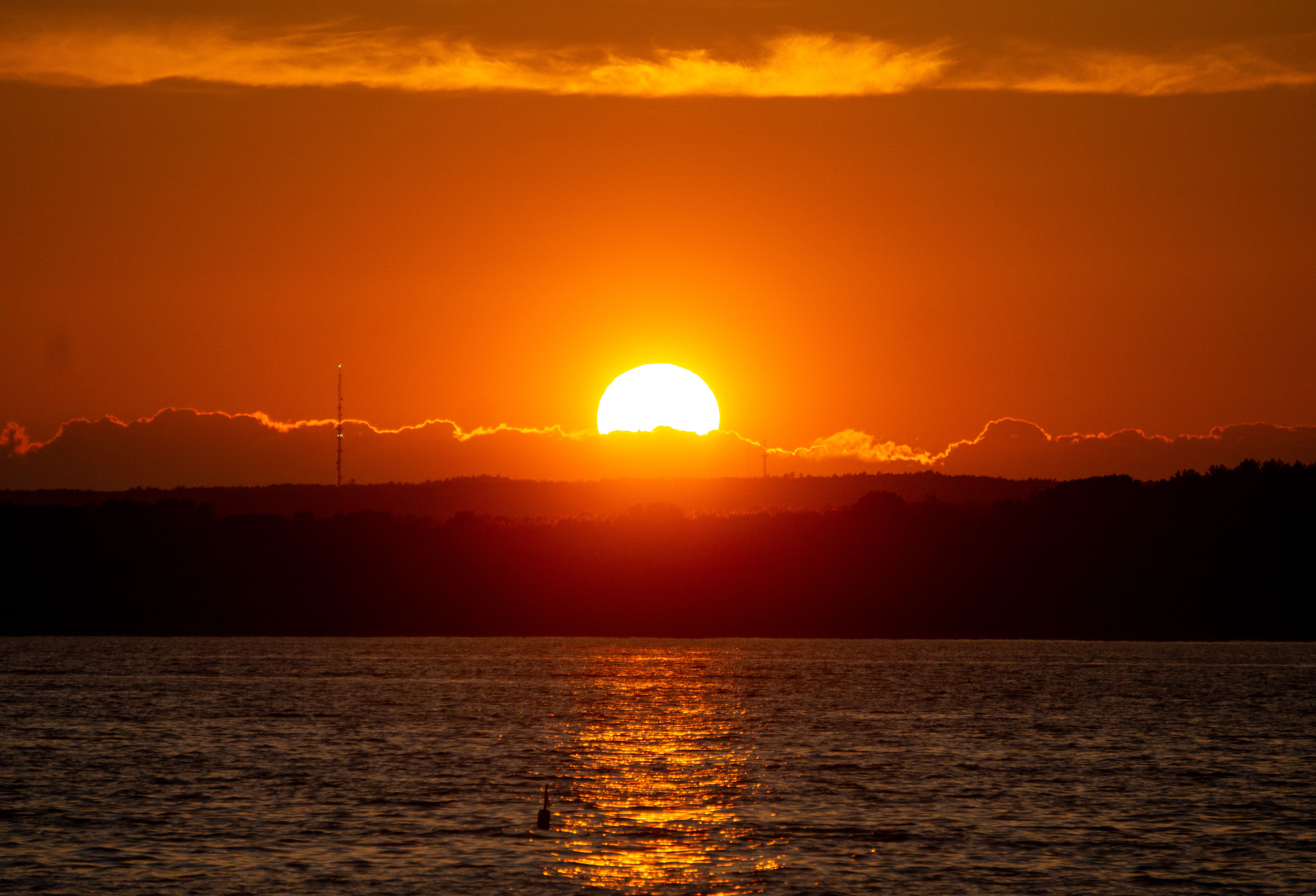 Stunning Sunset Over Calm Ocean Waters · Free Stock Photo