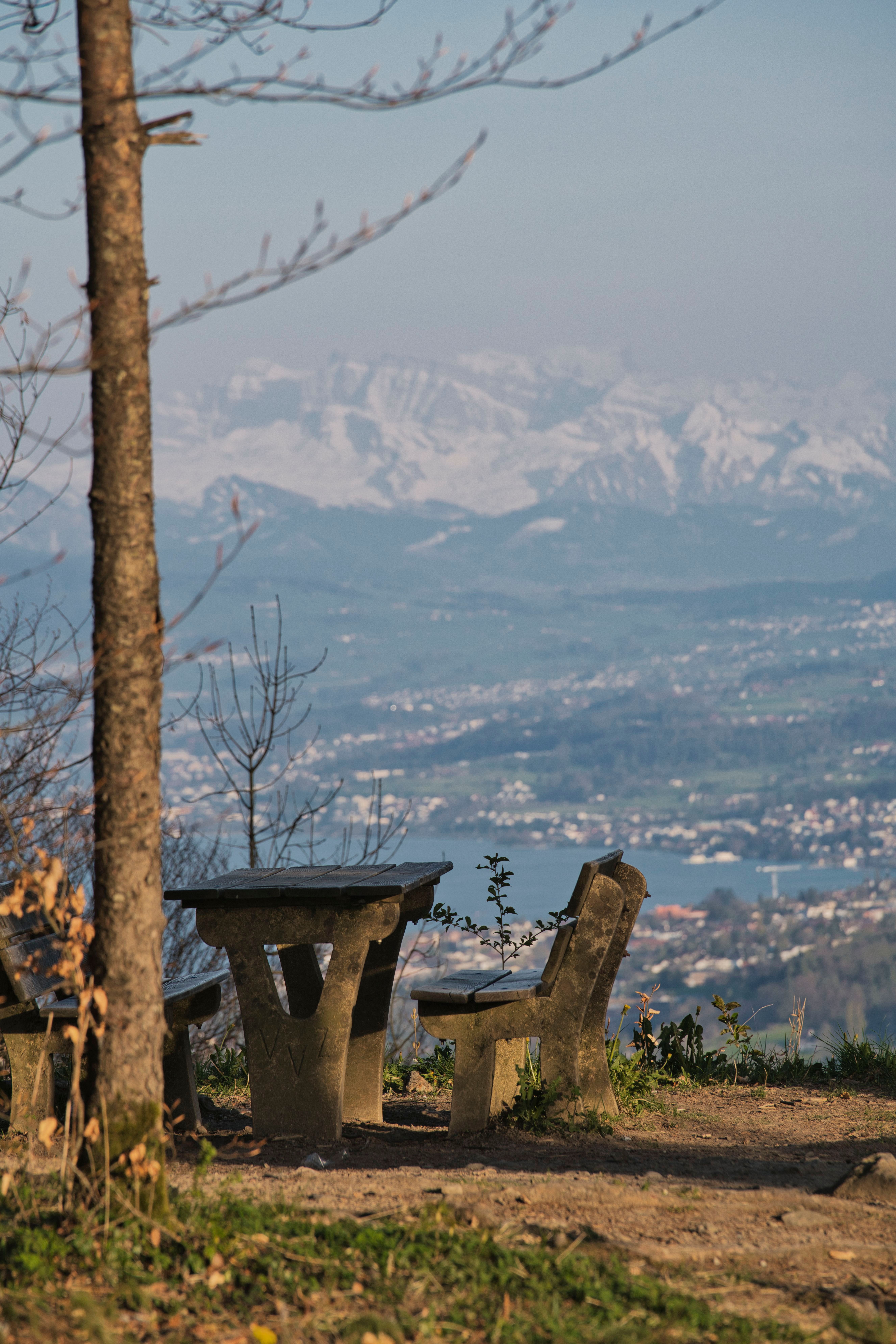 Scenic Mountain View with Stone Bench and Table · Free Stock Photo