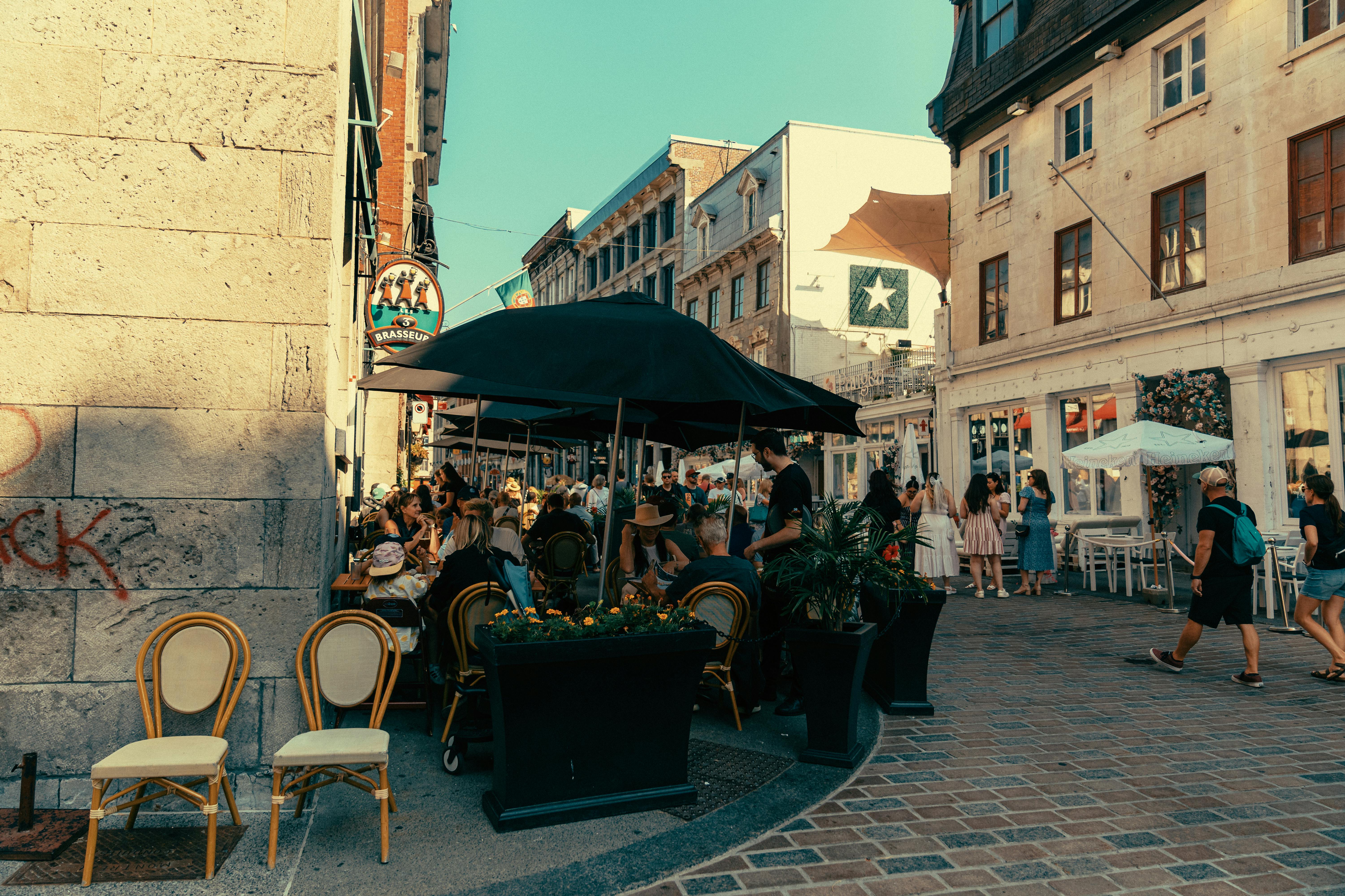 Charming Outdoor Café Scene in Old Quebec City · Free Stock Photo