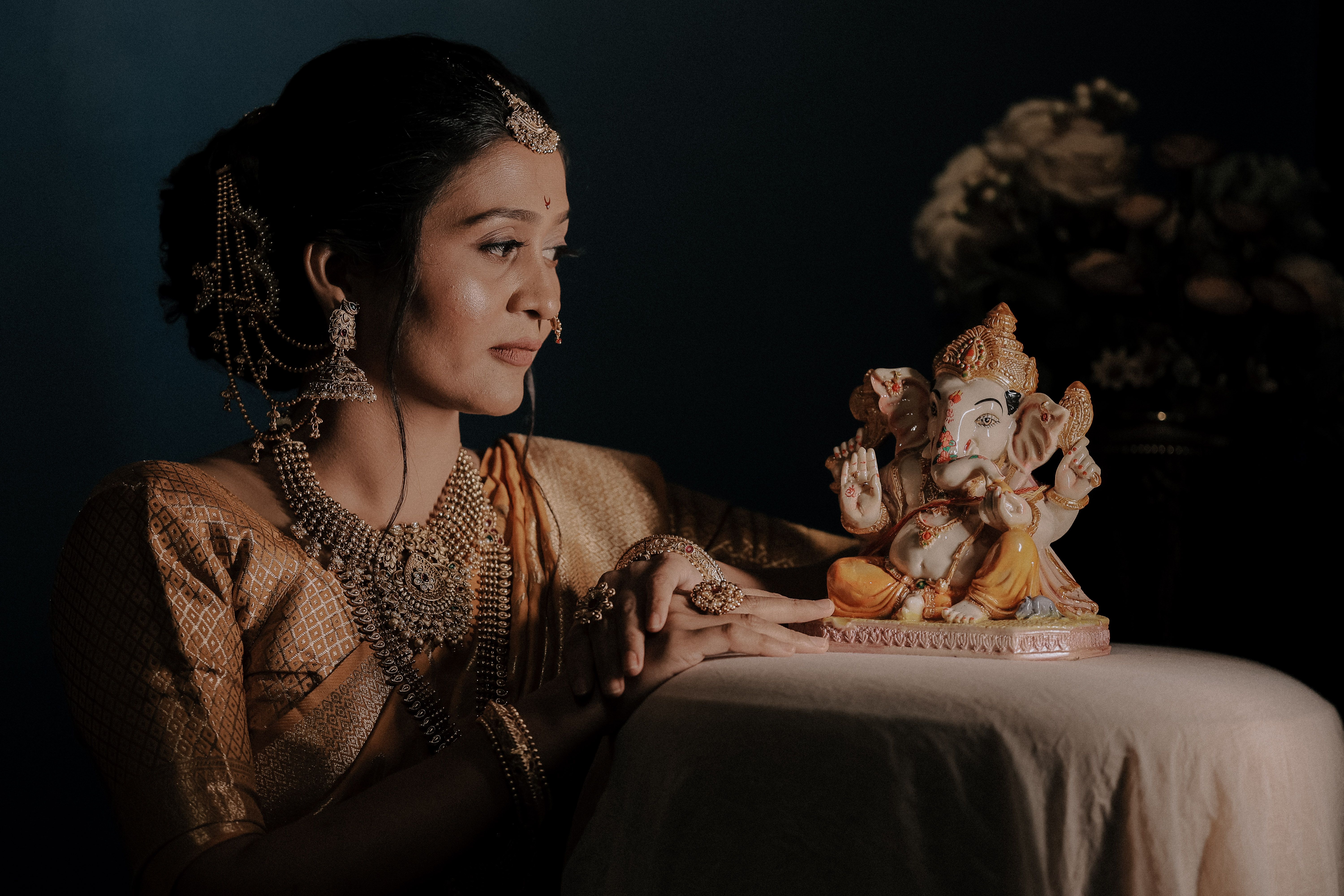 Portrait of Woman with Ganesha Idol in Traditional Attire · Free Stock ...