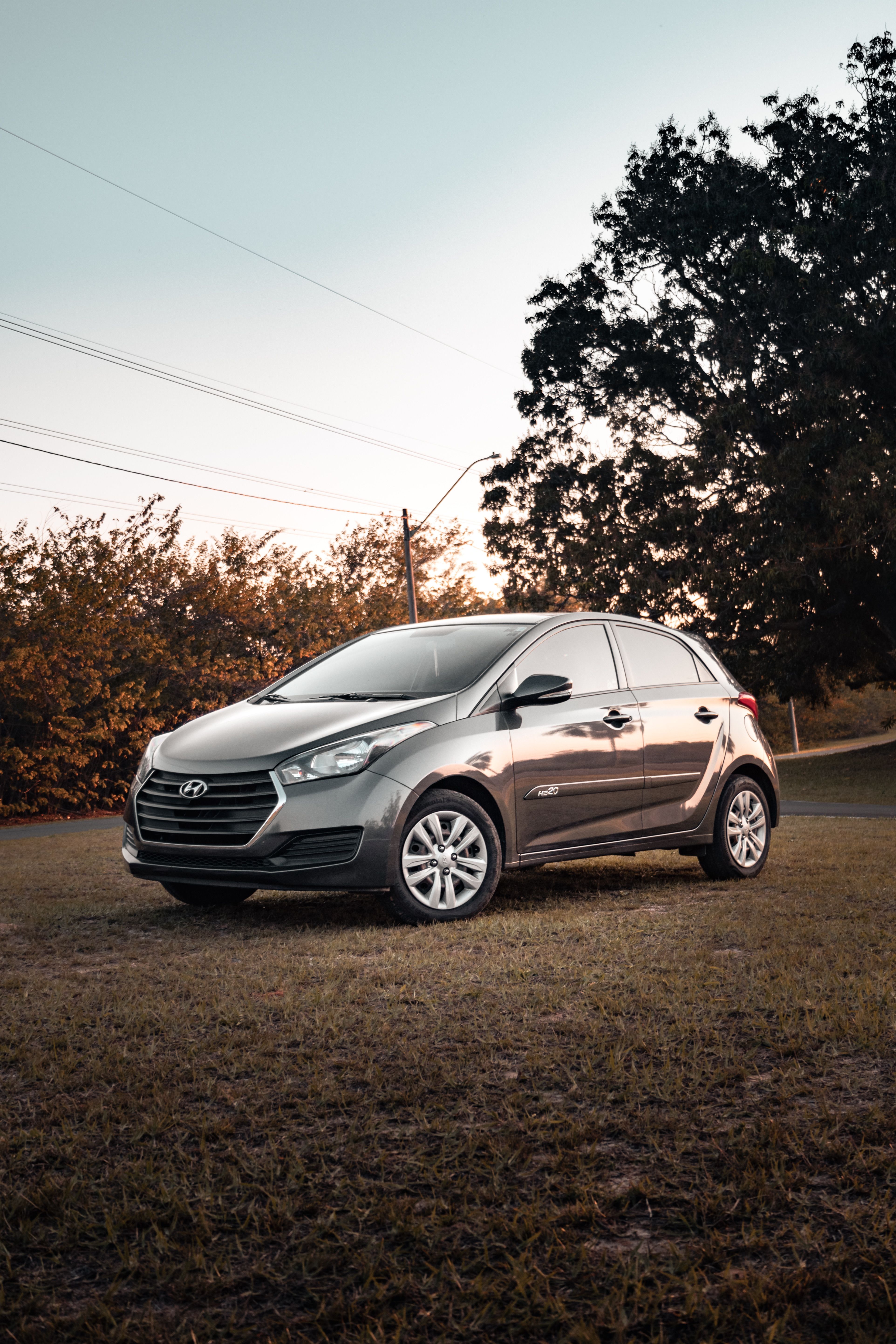 Sleek Compact Car Parked Outdoors at Sunset · Free Stock Photo