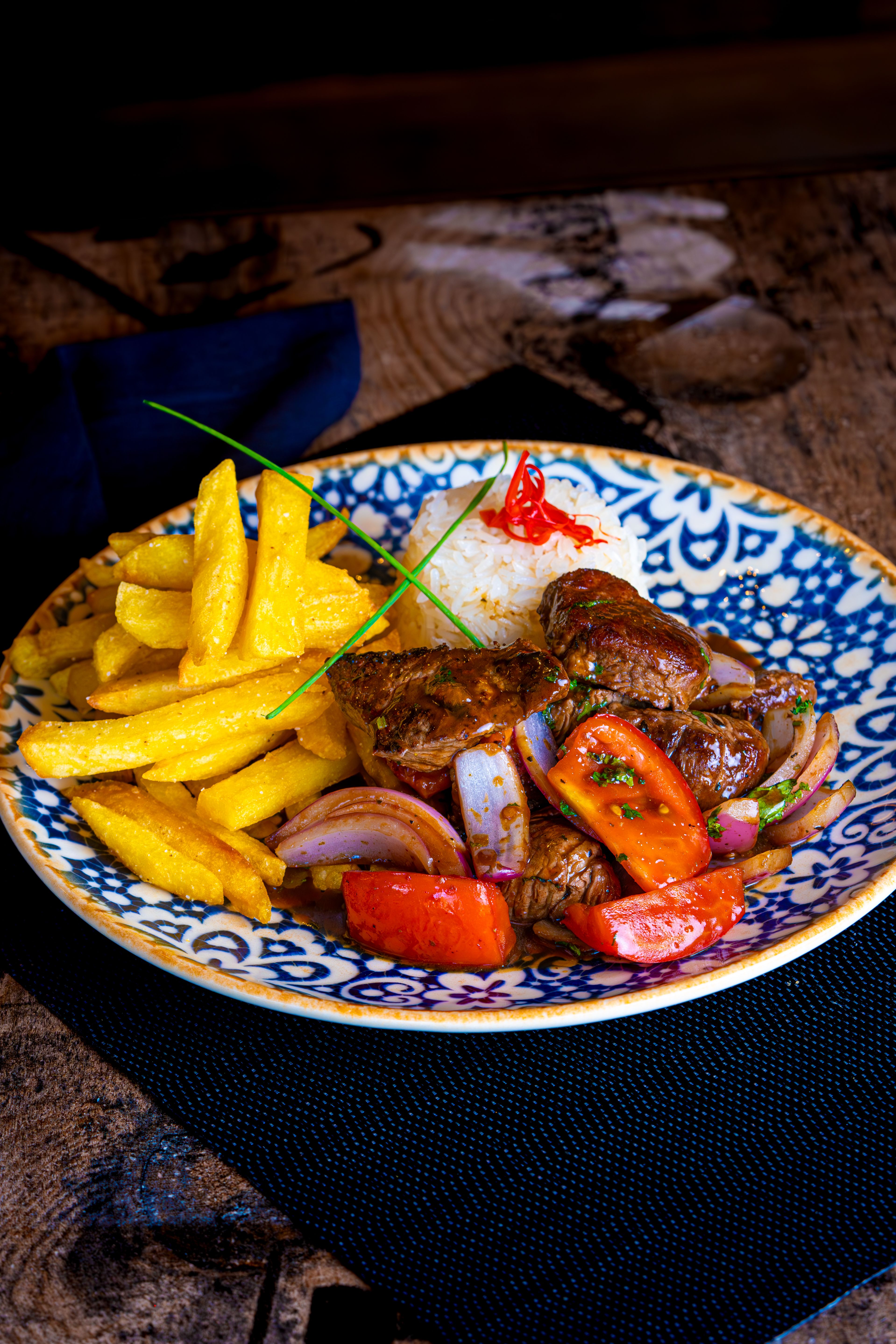 Delicious Lomo Saltado with Crispy Fries · Free Stock Photo