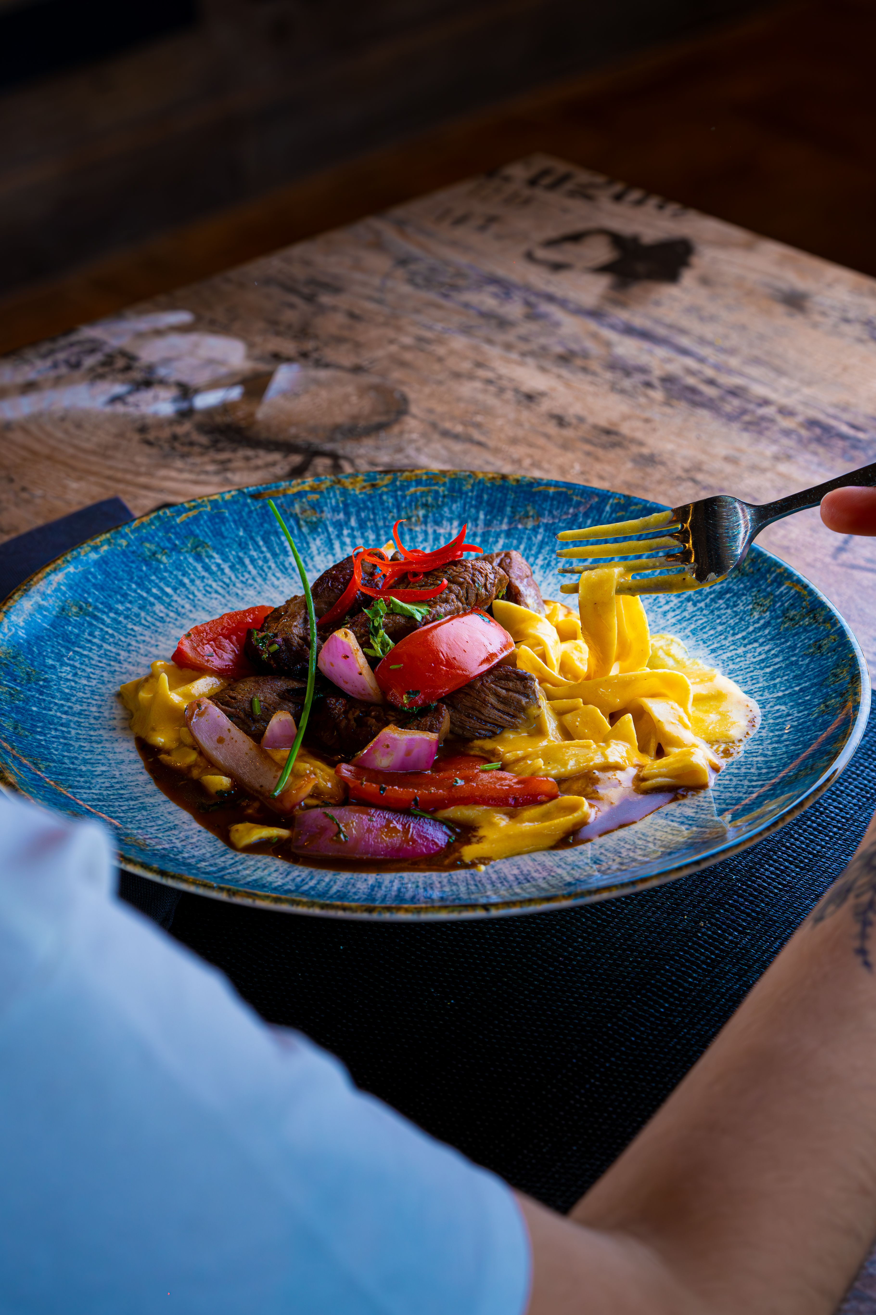 Delicious Gourmet Pasta Dish on Rustic Table · Free Stock Photo