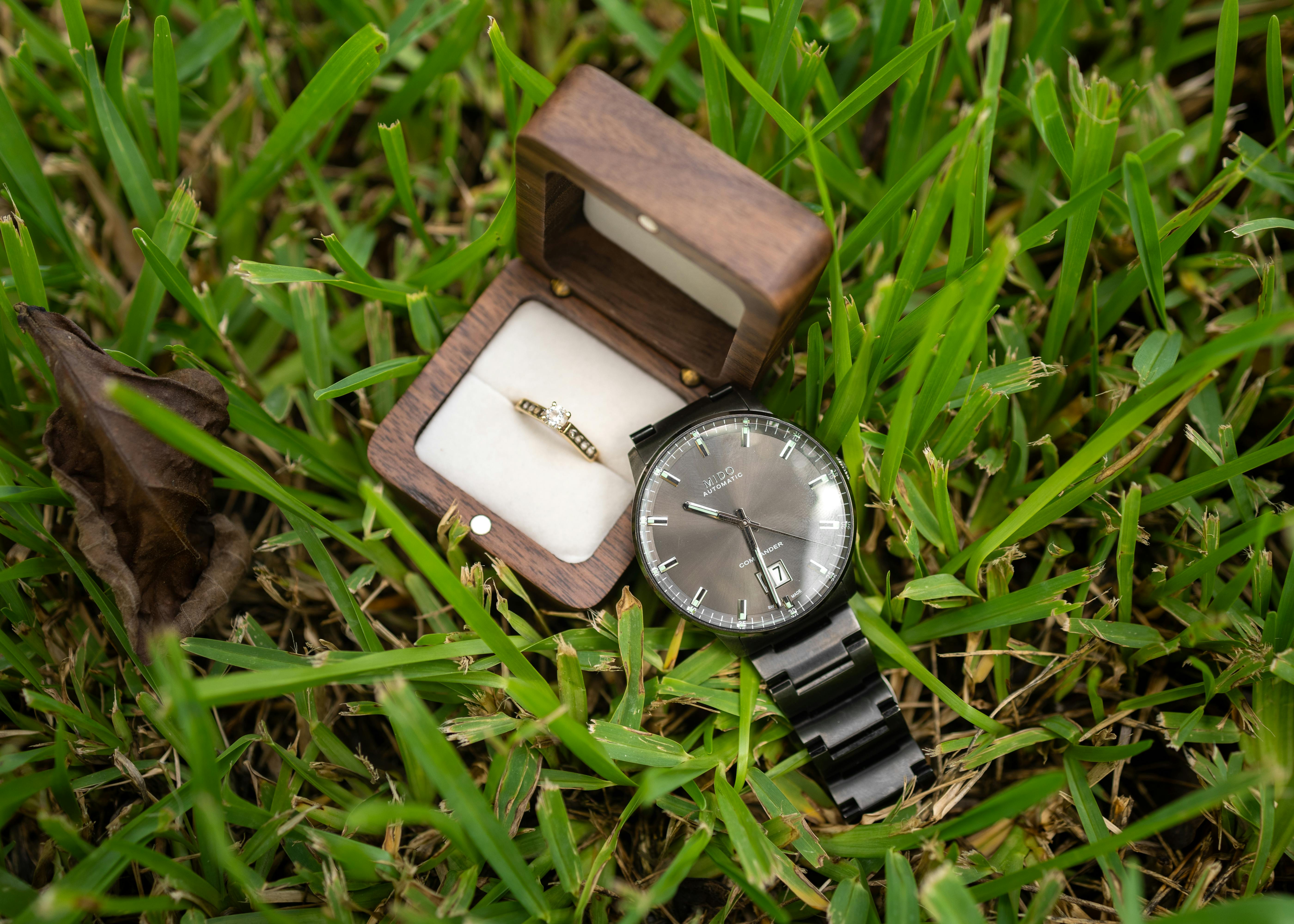 Engagement Ring and Watch in Grass: Love and Time · Free Stock Photo