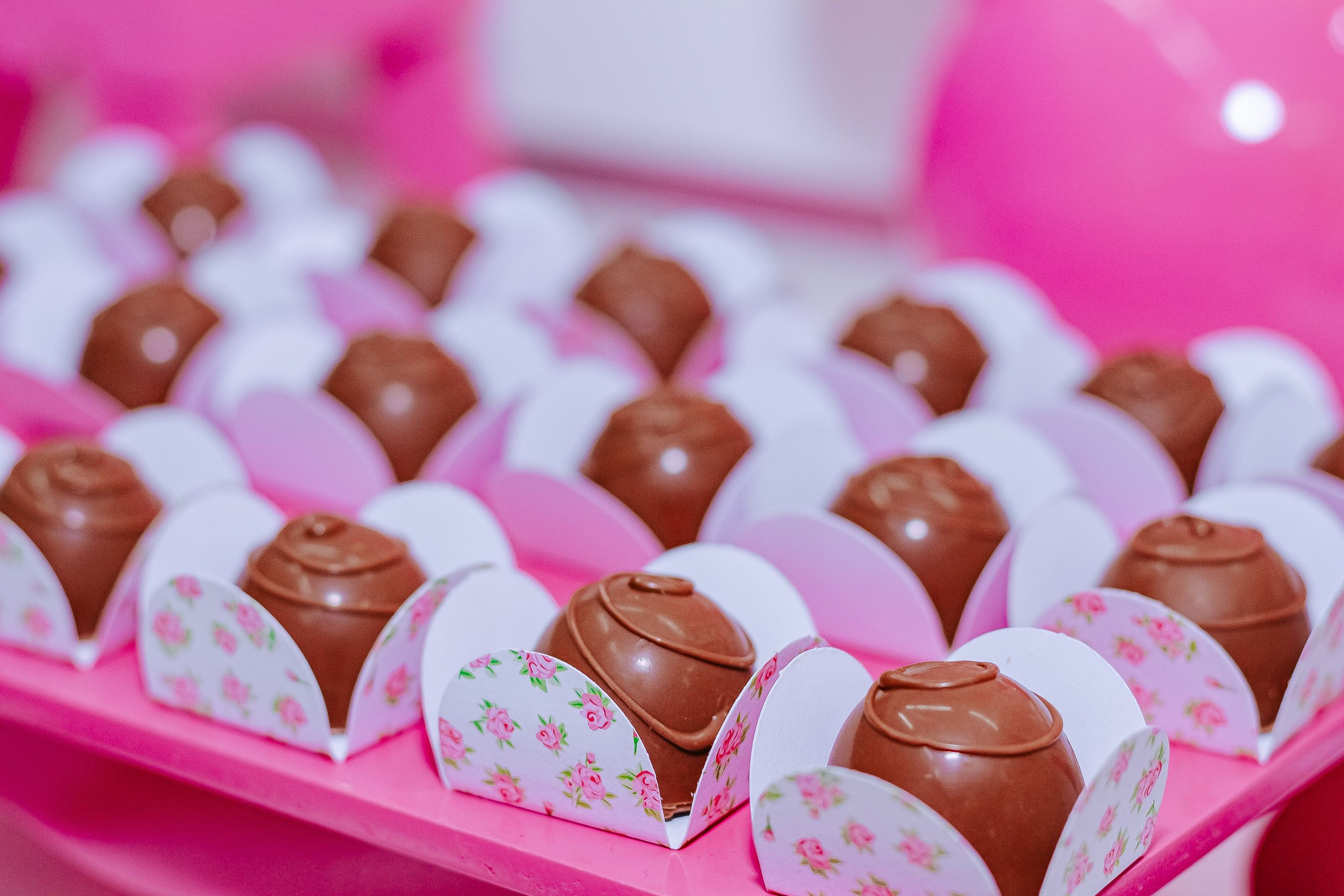 Elegant Chocolate Truffles on Pink Display · Free Stock Photo