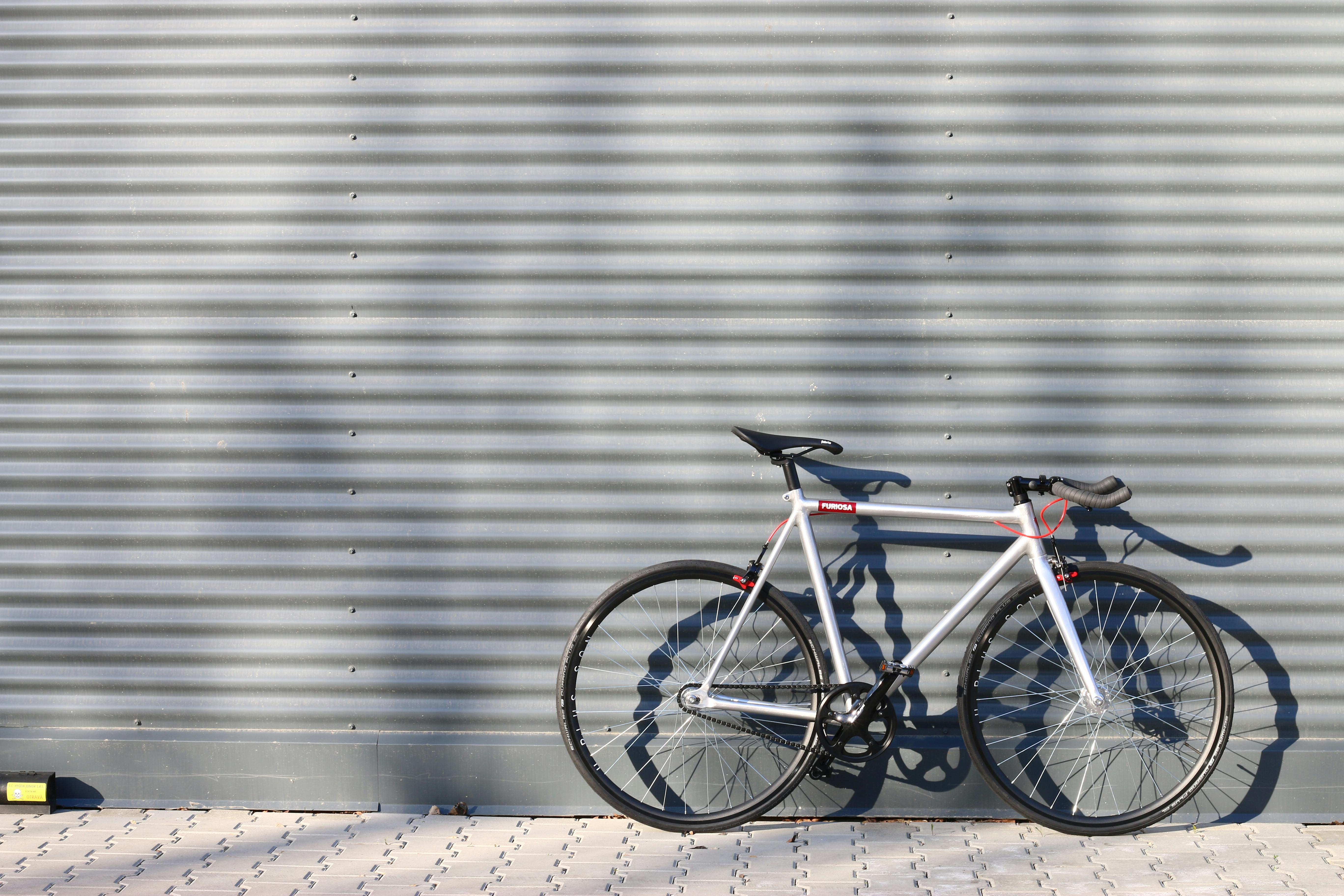 Minimalist Bicycle Against Modern Wall · Free Stock Photo