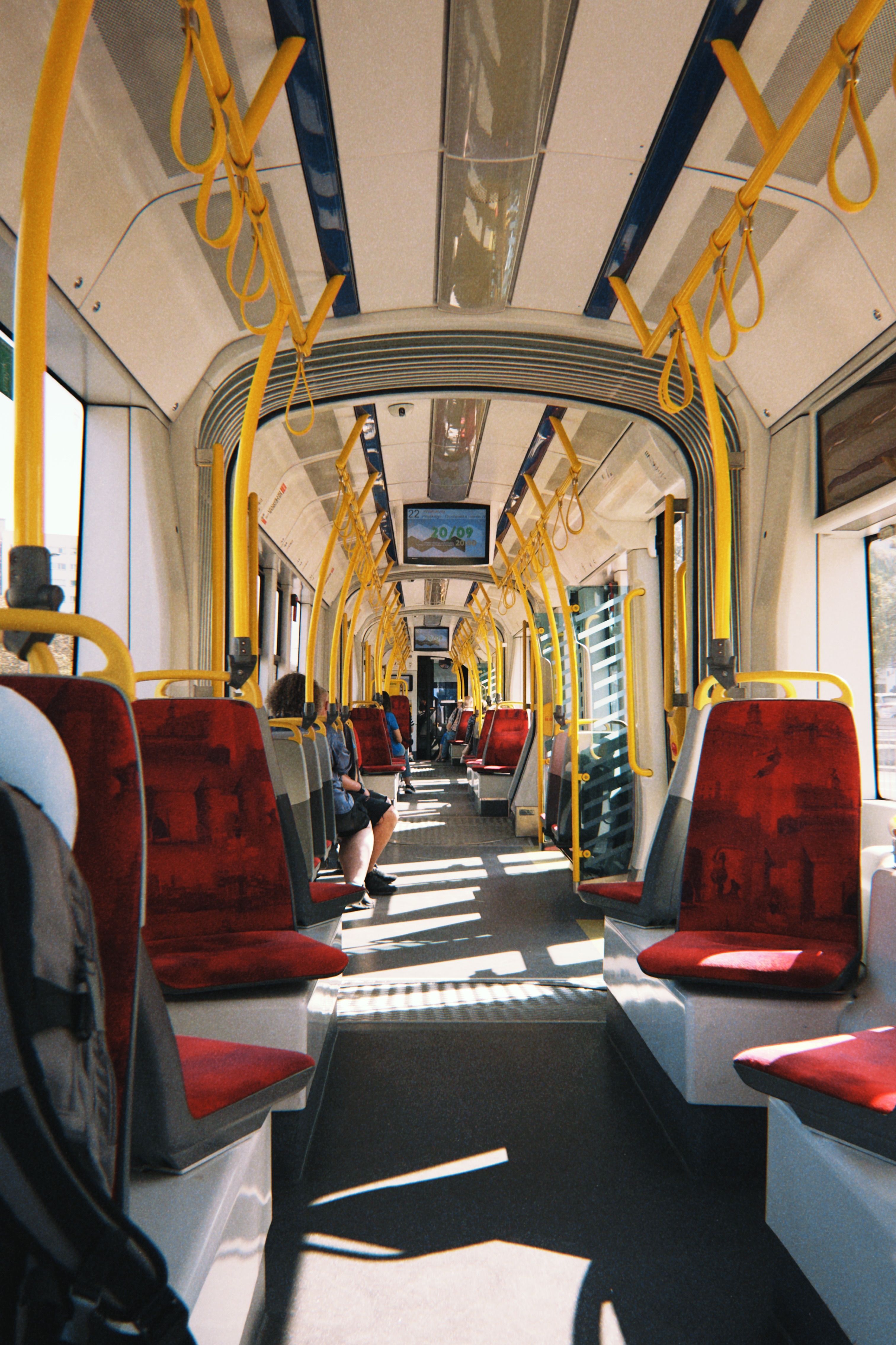 Interior of Warsaw tram with yellow handrails · Free Stock Photo