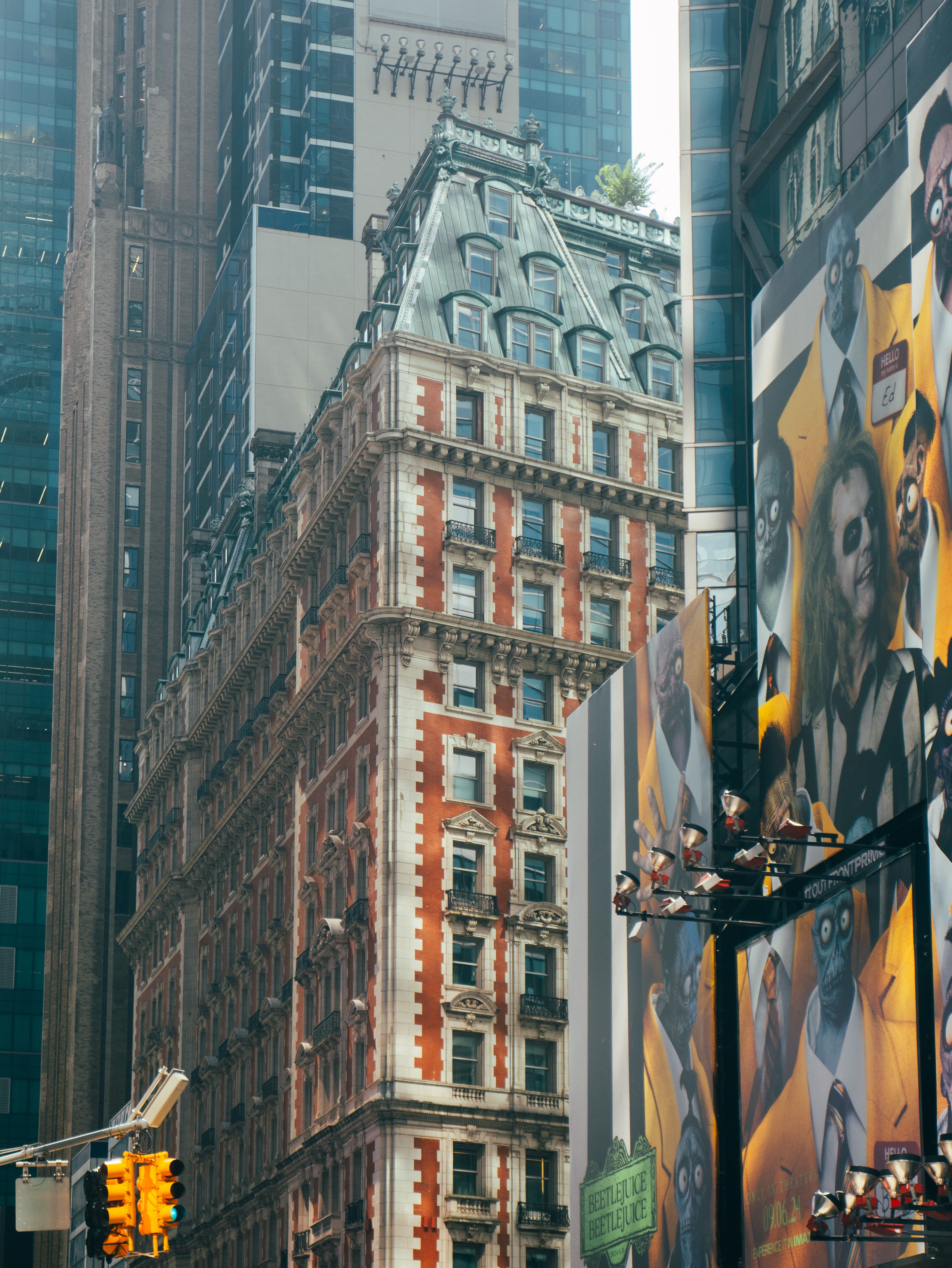 Iconic Architecture and Billboards in Urban Setting · Free Stock Photo