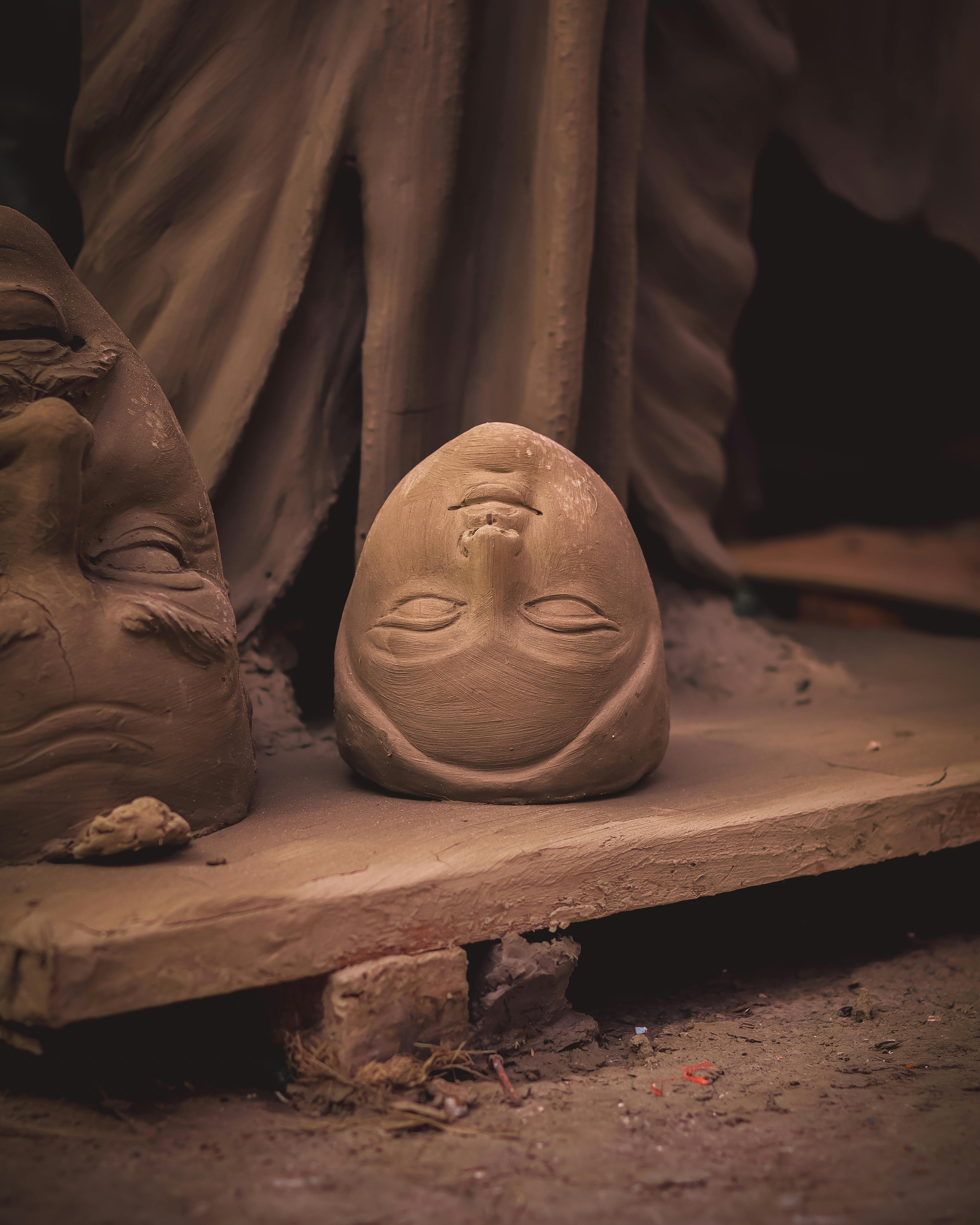 Sculpted Clay Masks in Artisan Workshop · Free Stock Photo