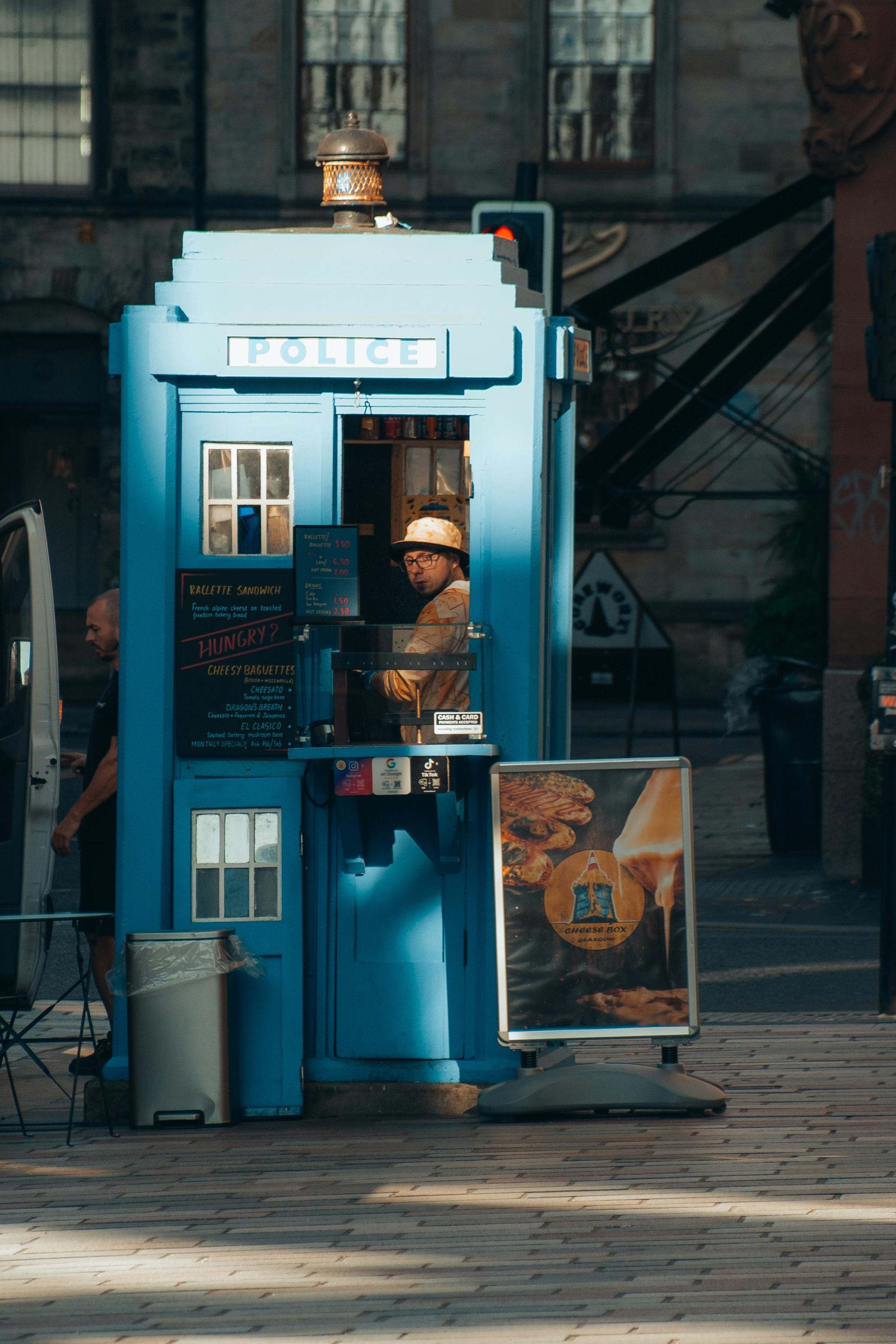 Blue Police Booth in Urban Square · Free Stock Photo