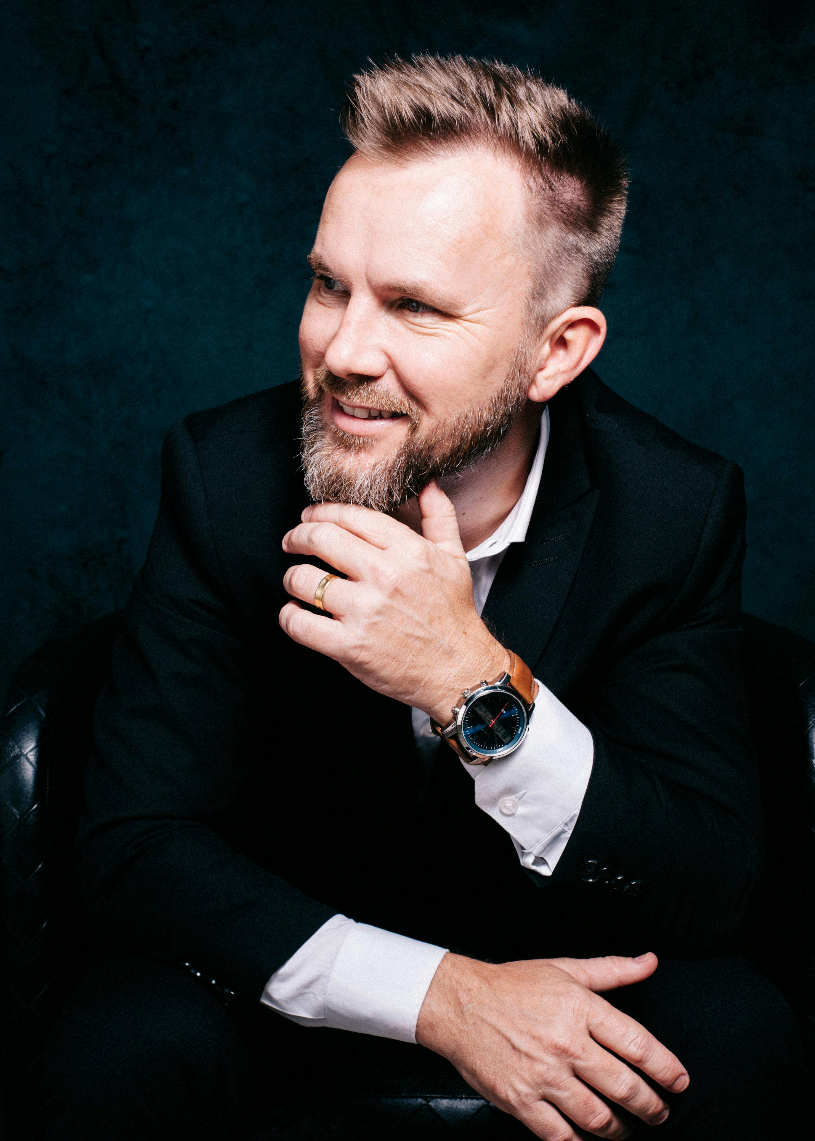 Confident Man Smiling in a Suit Portrait · Free Stock Photo