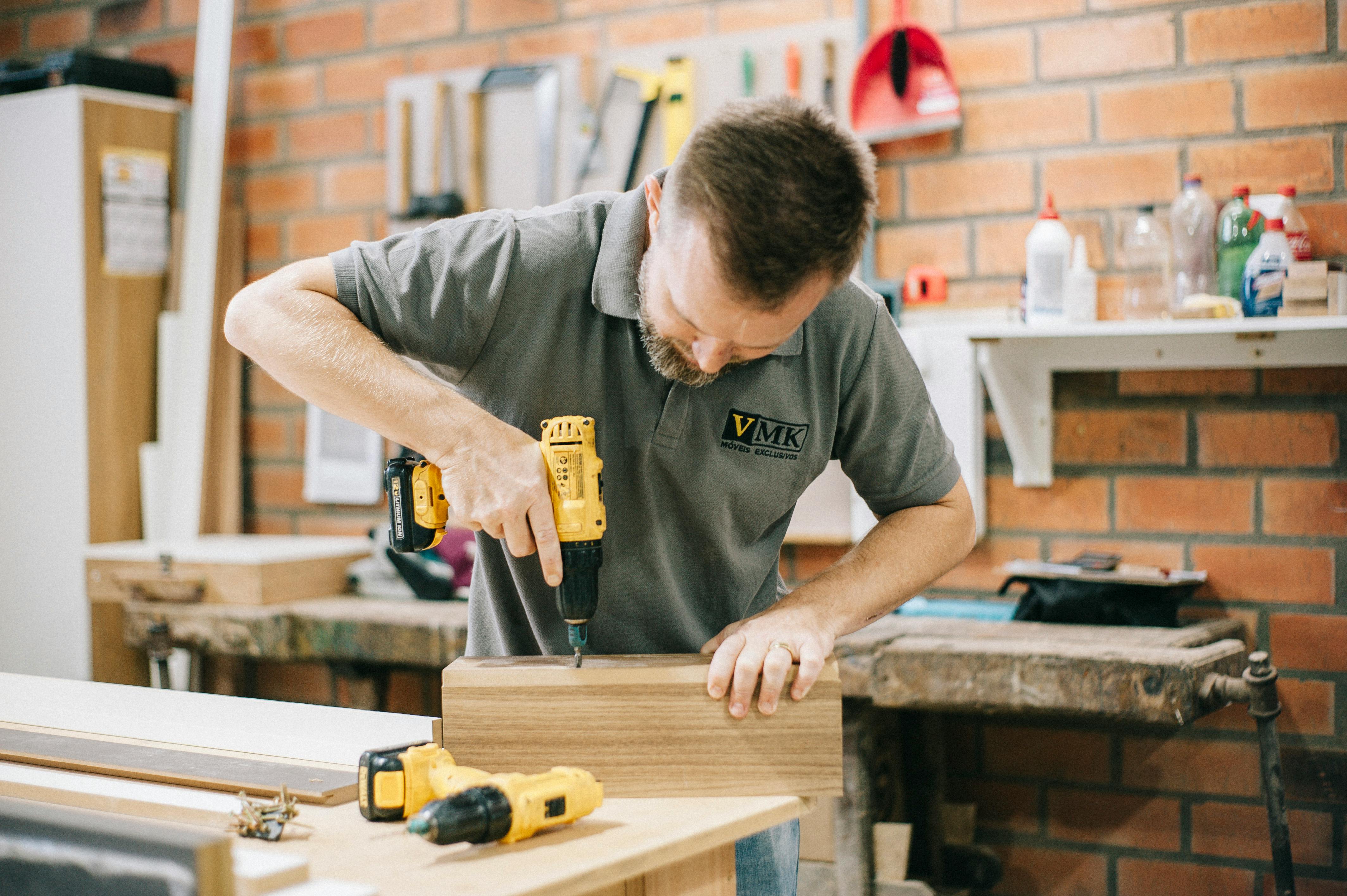 Person Using Dewalt Cordless Impact Driver on Brown Board · Free Stock ...