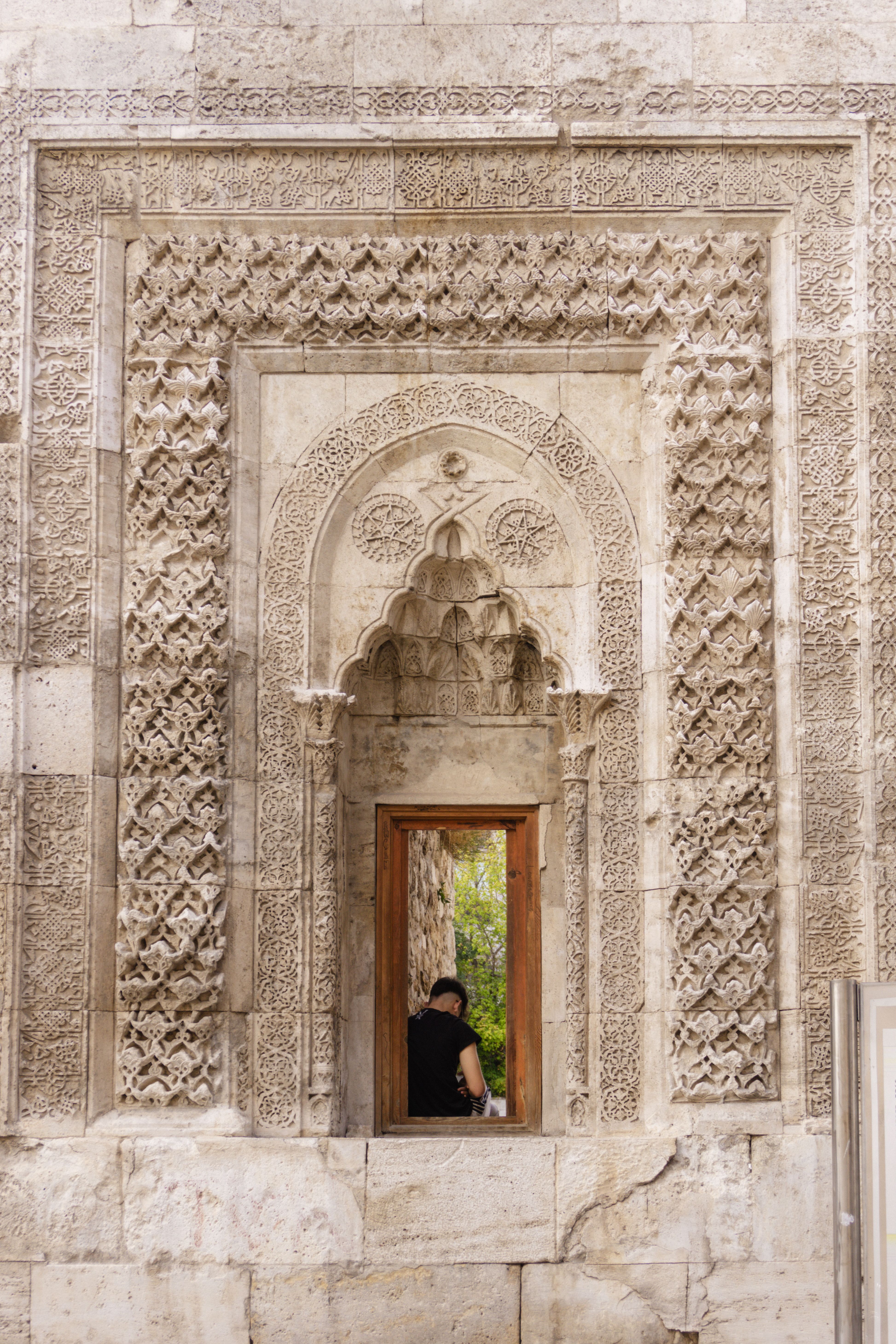 Intricately Carved Stone Archway with Figure · Free Stock Photo