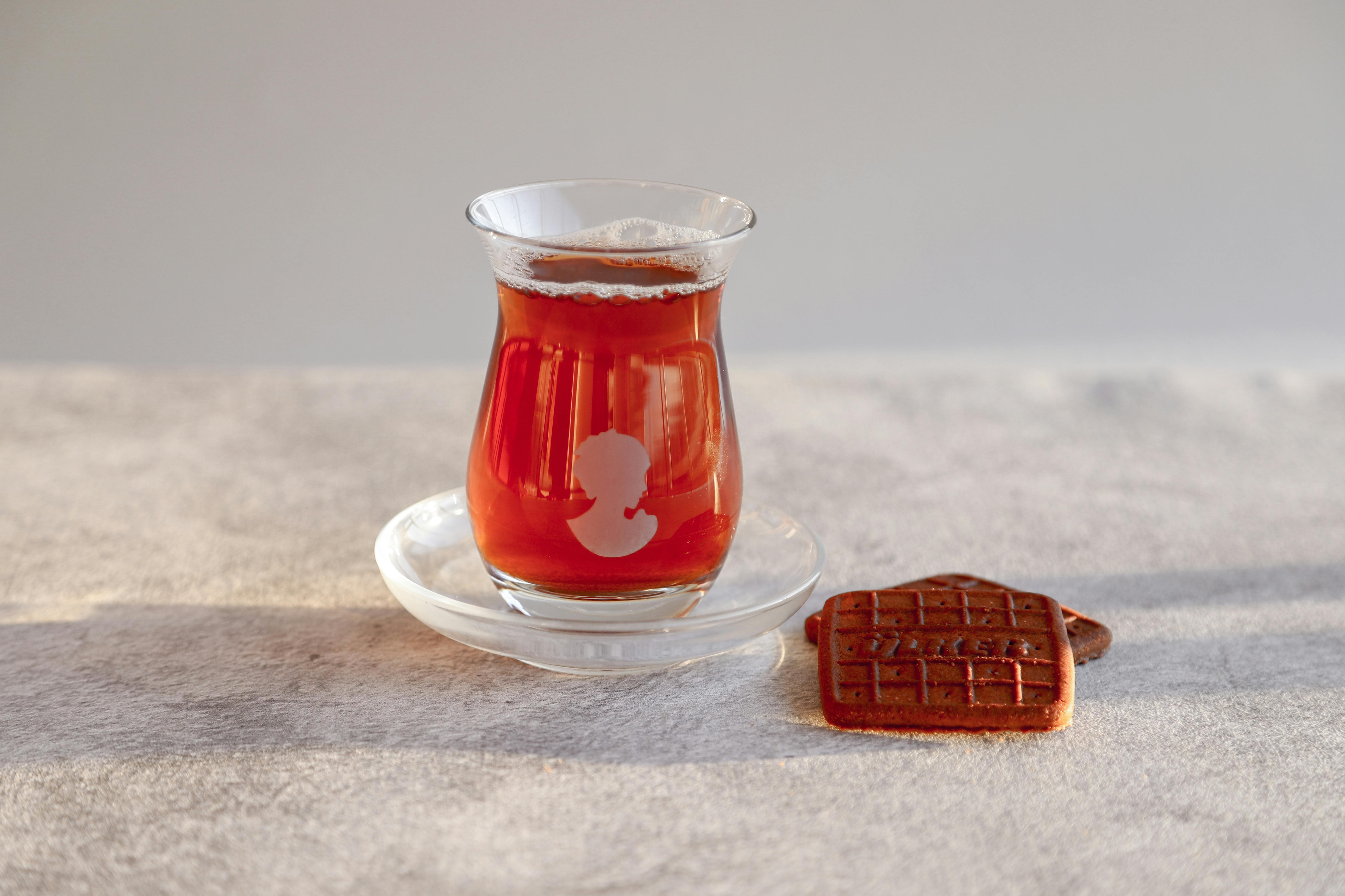 Turkish Tea with Biscuit on Sunlit Table · Free Stock Photo