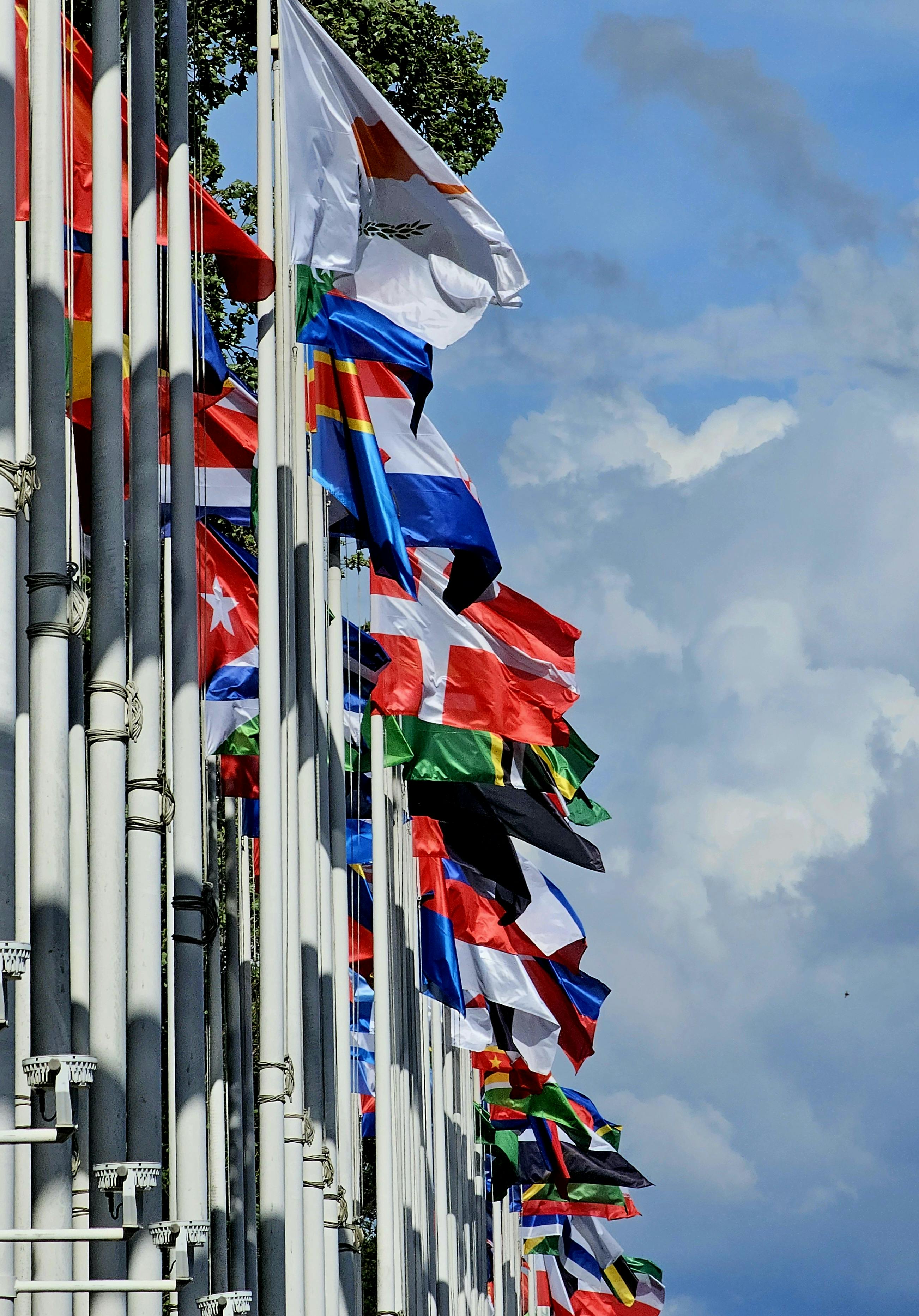 Vibrant Display of International Flags in Lisbon · Free Stock Photo