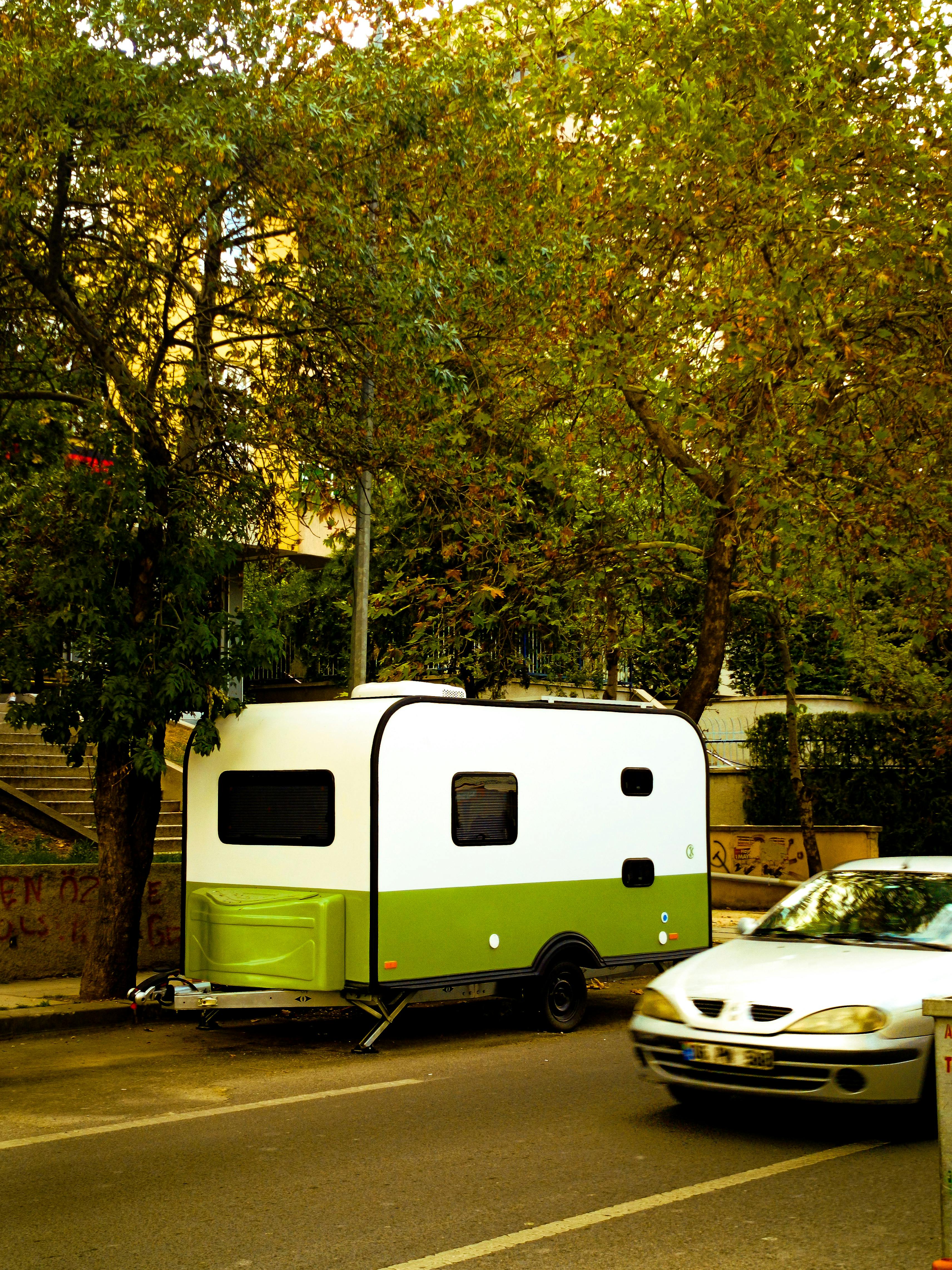 Green Caravan Parked on a Street in Ankara · Free Stock Photo