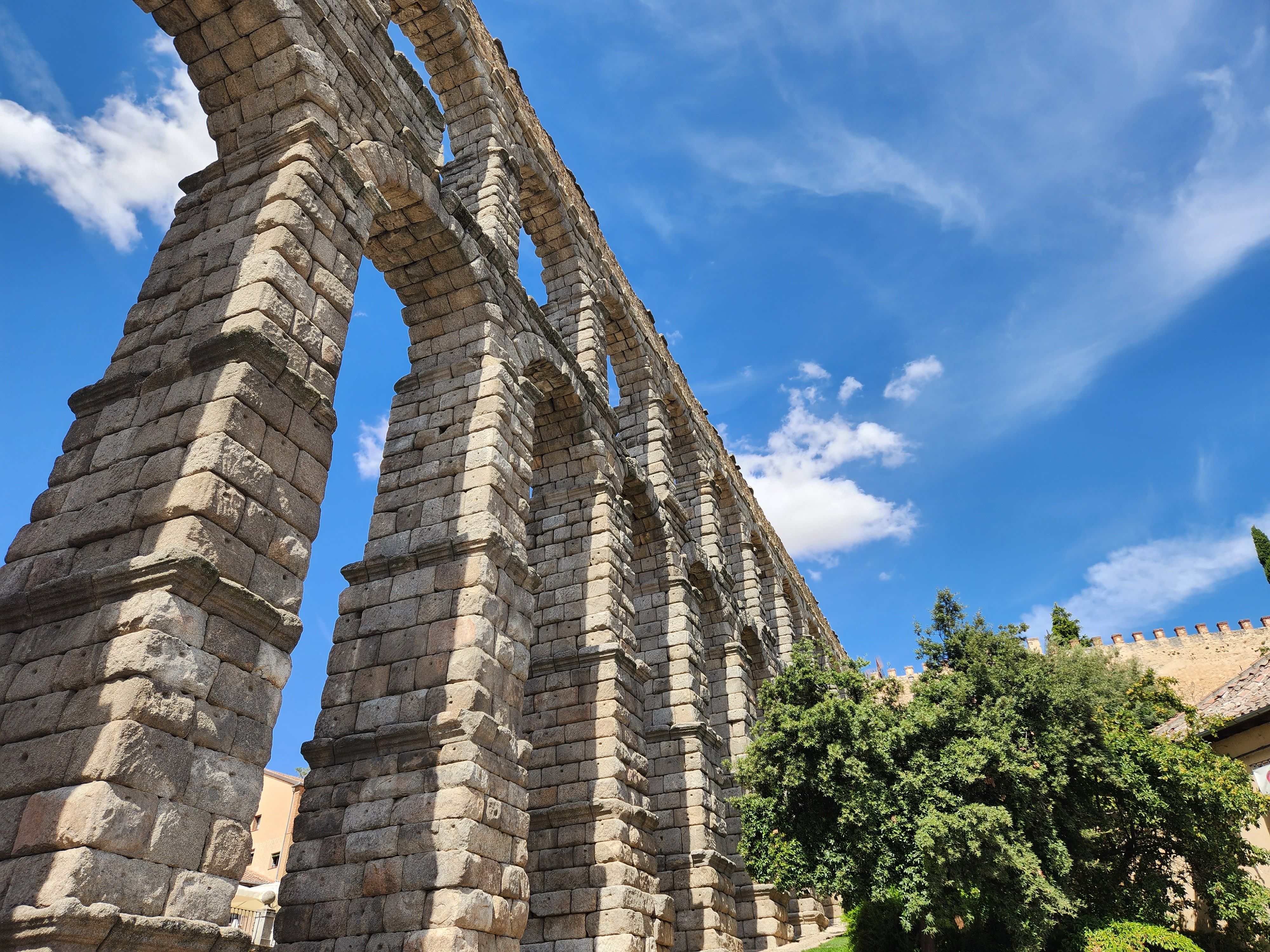Ancient Roman Aqueduct Against Blue Sky · Free Stock Photo