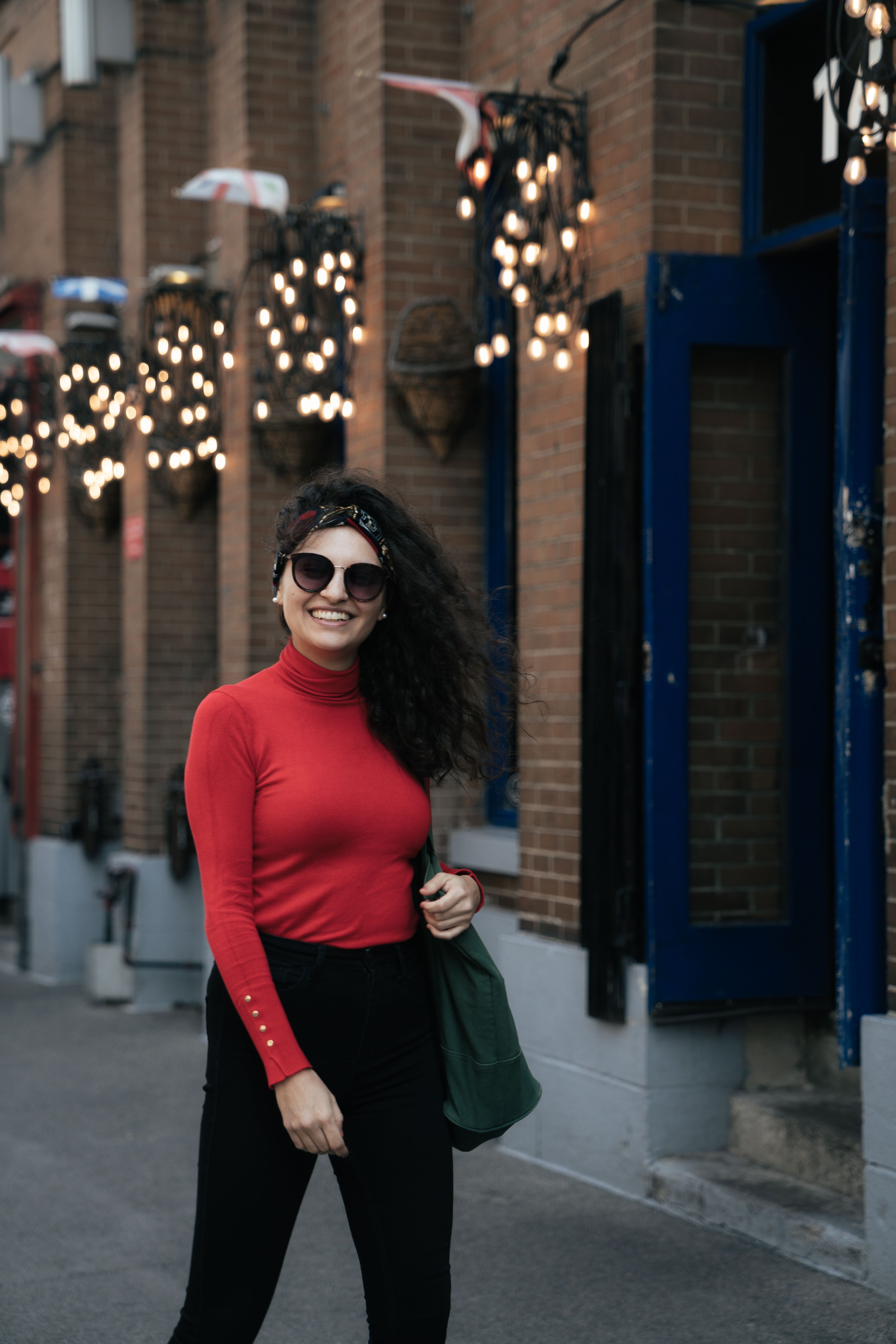 Smiling Woman in Red Enjoying Québec City's Streets · Free Stock Photo