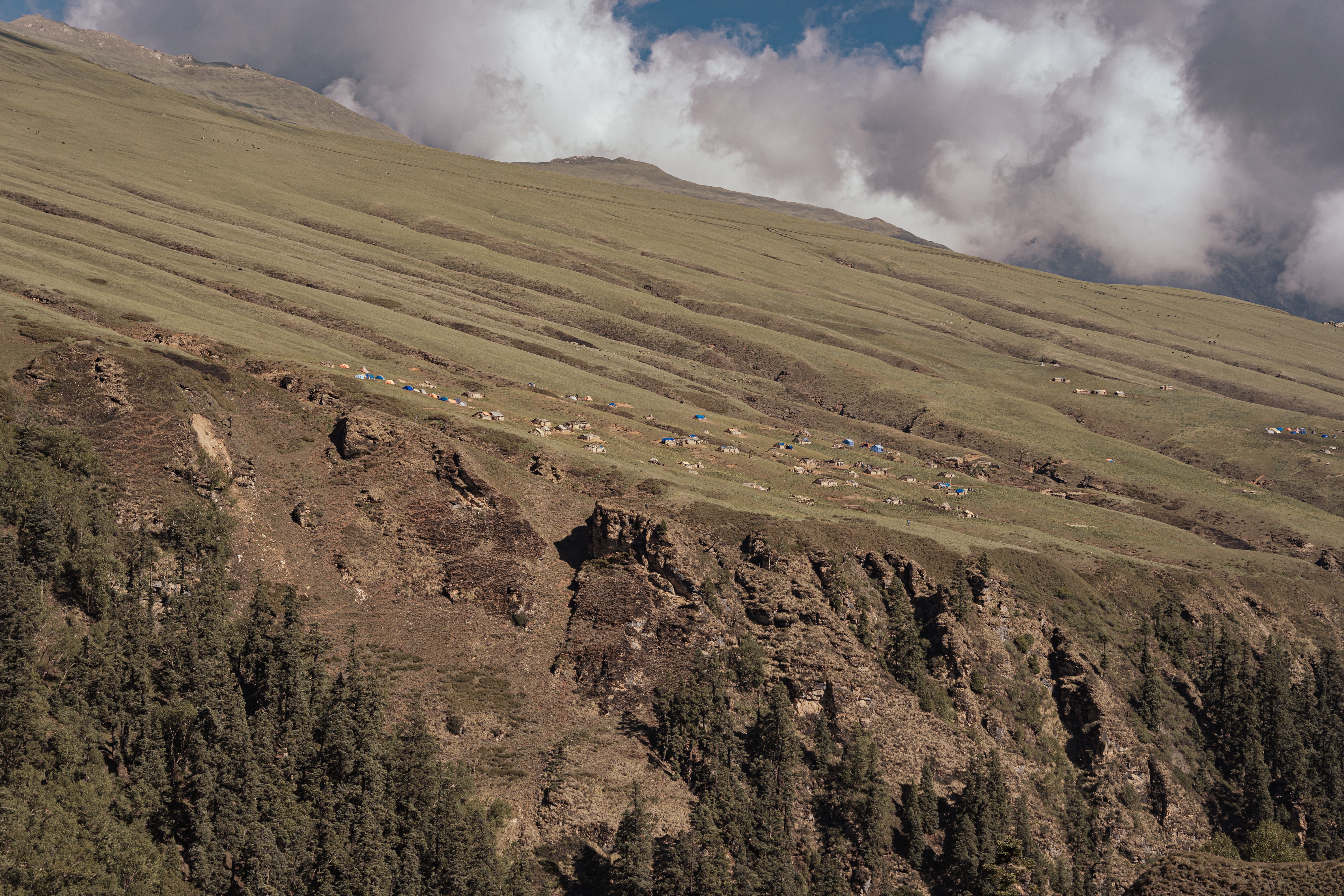 Panoramic Landscape of Mountain Terrain with Tents · Free Stock Photo