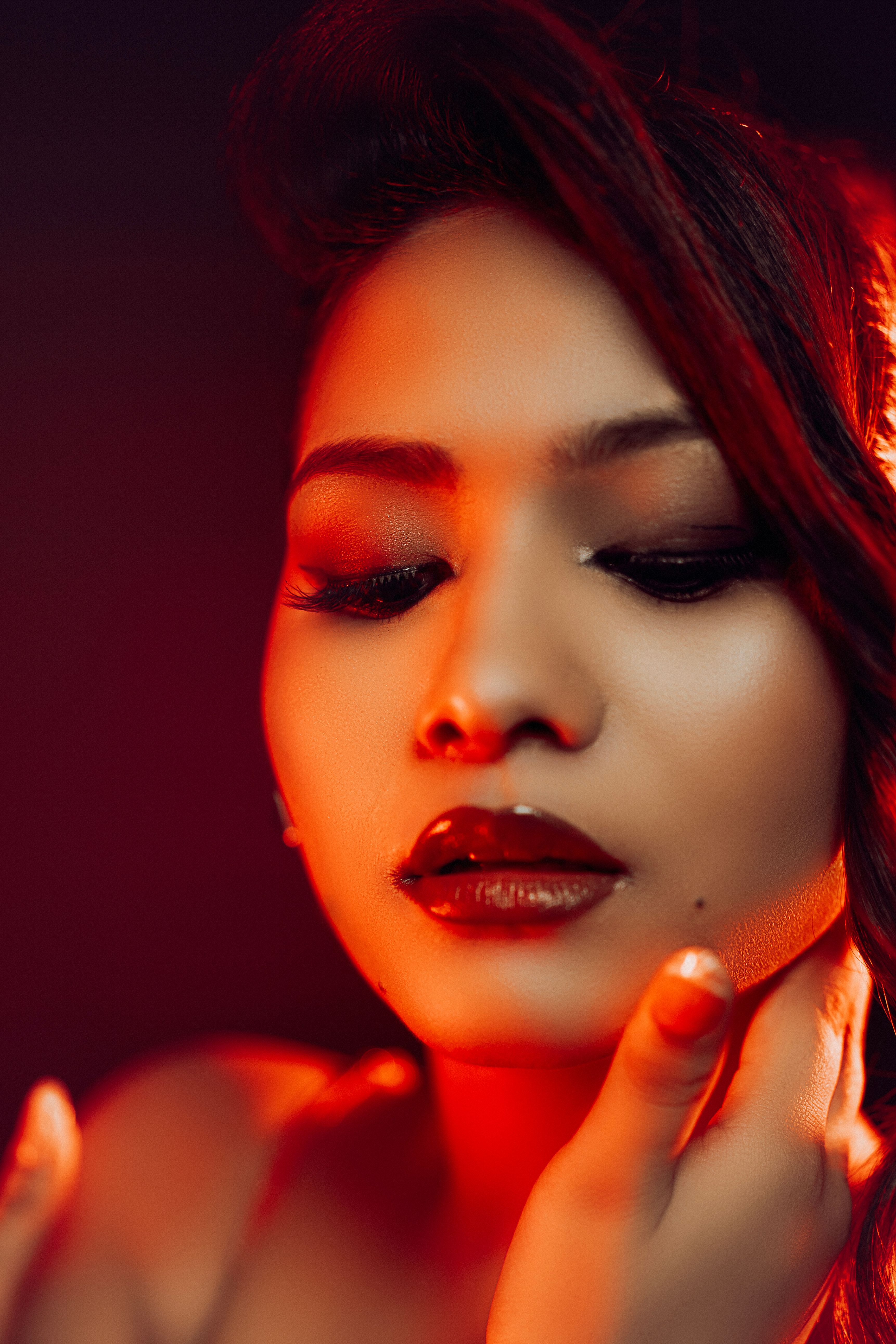 Red-Toned Close-Up Portrait of a Woman · Free Stock Photo