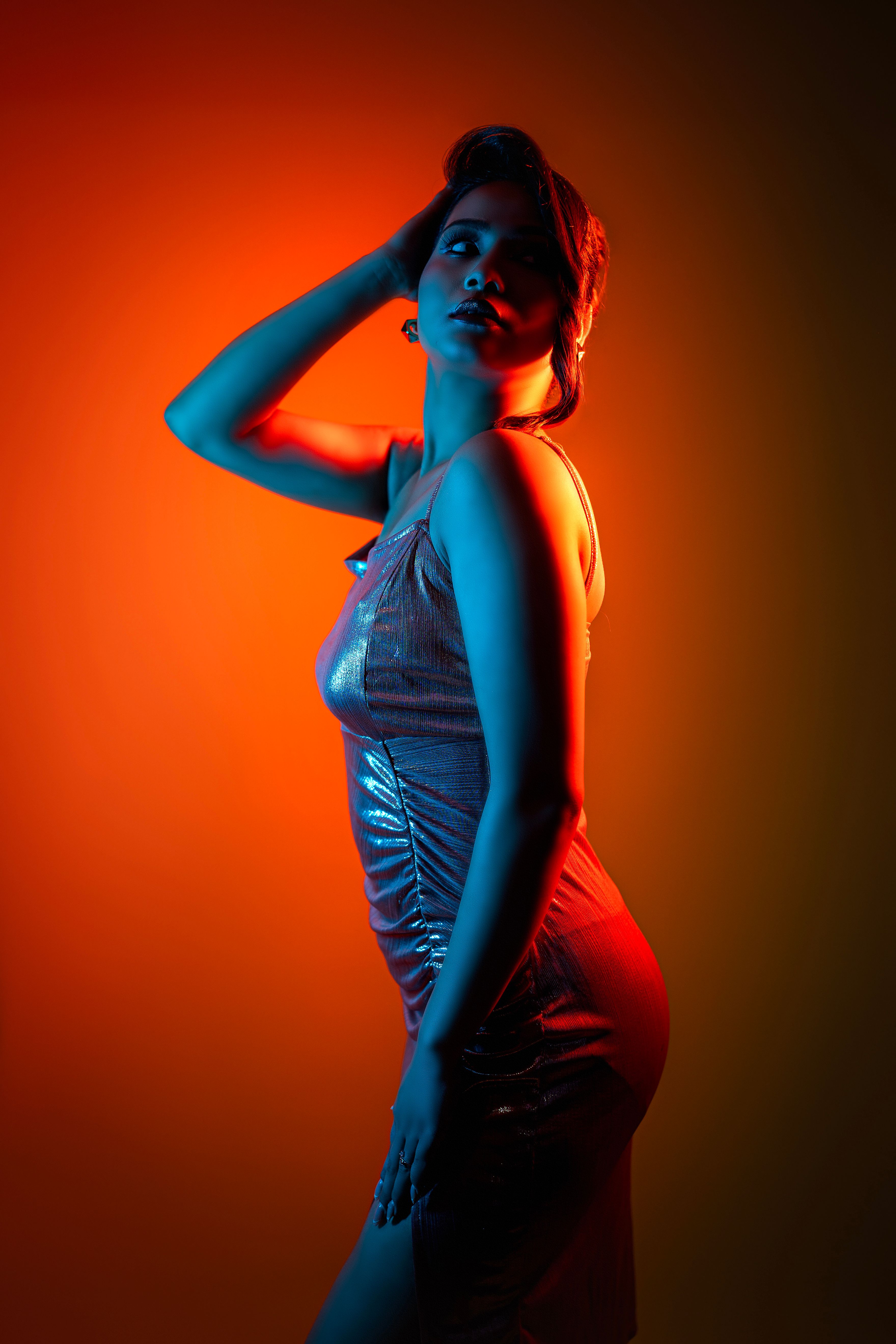 Dramatic Portrait in Colorful Stage Lighting · Free Stock Photo