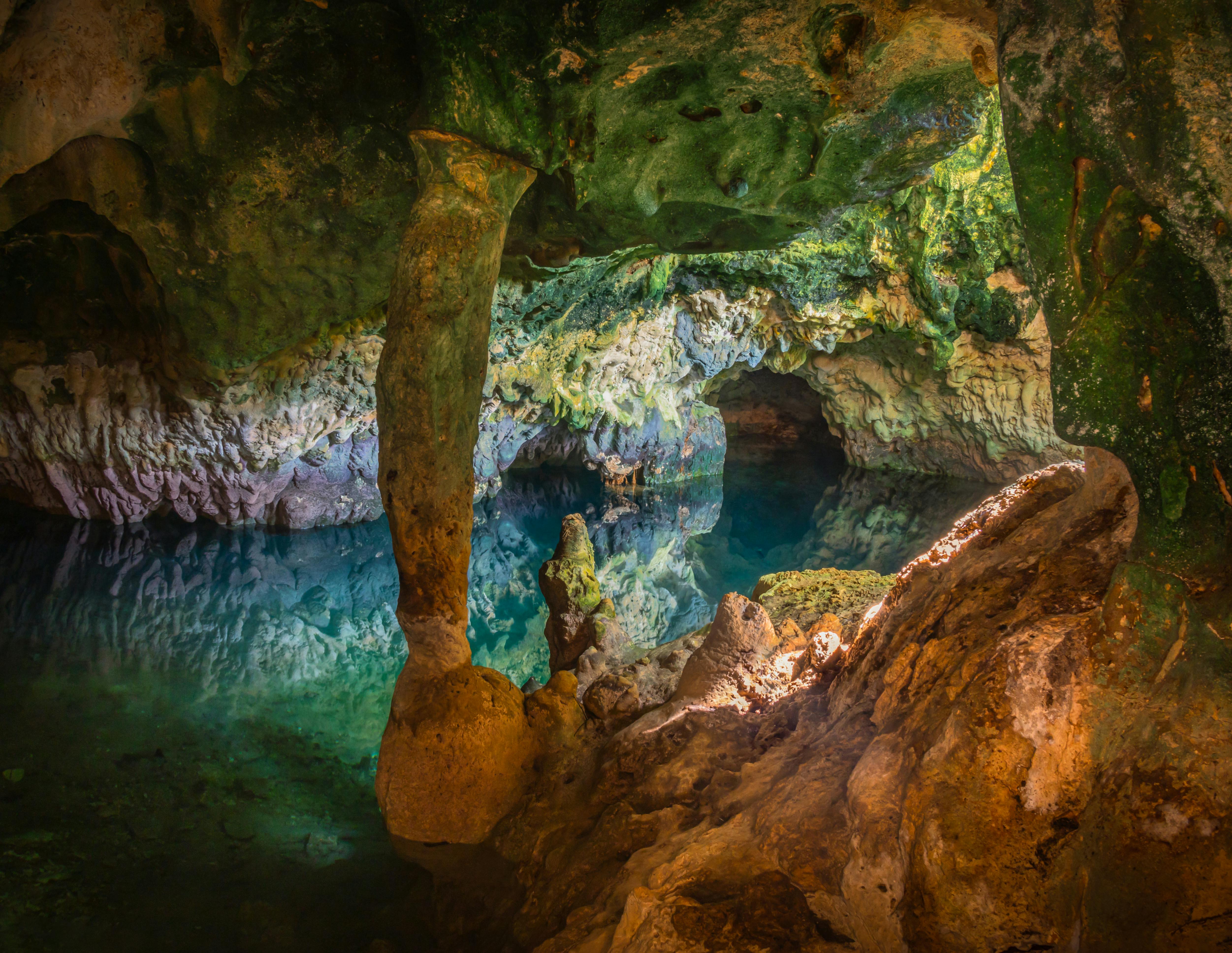 Stunning Limestone Cave with Reflective Pool · Free Stock Photo
