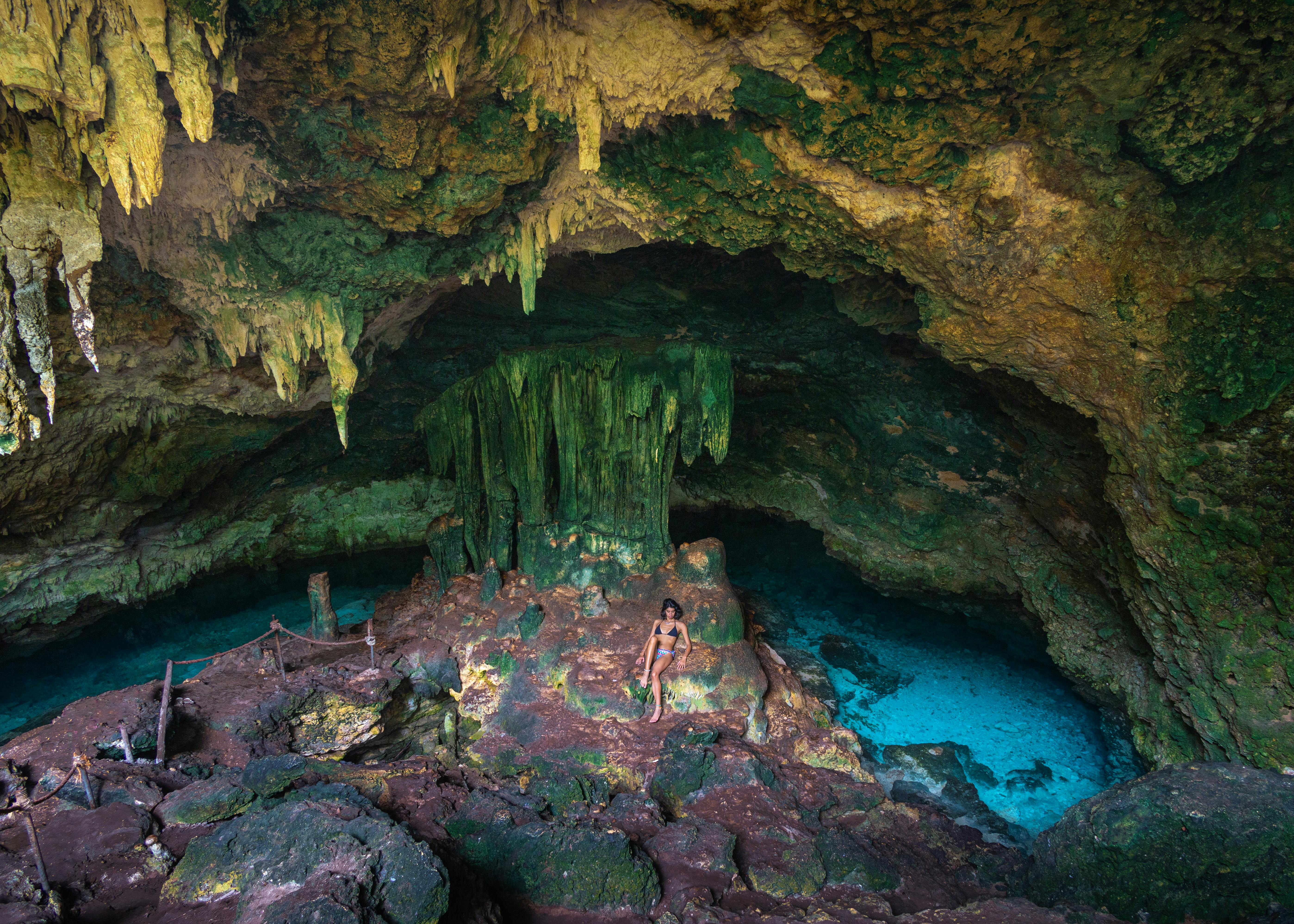 Exploring Vibrant Cave with Stalactites · Free Stock Photo