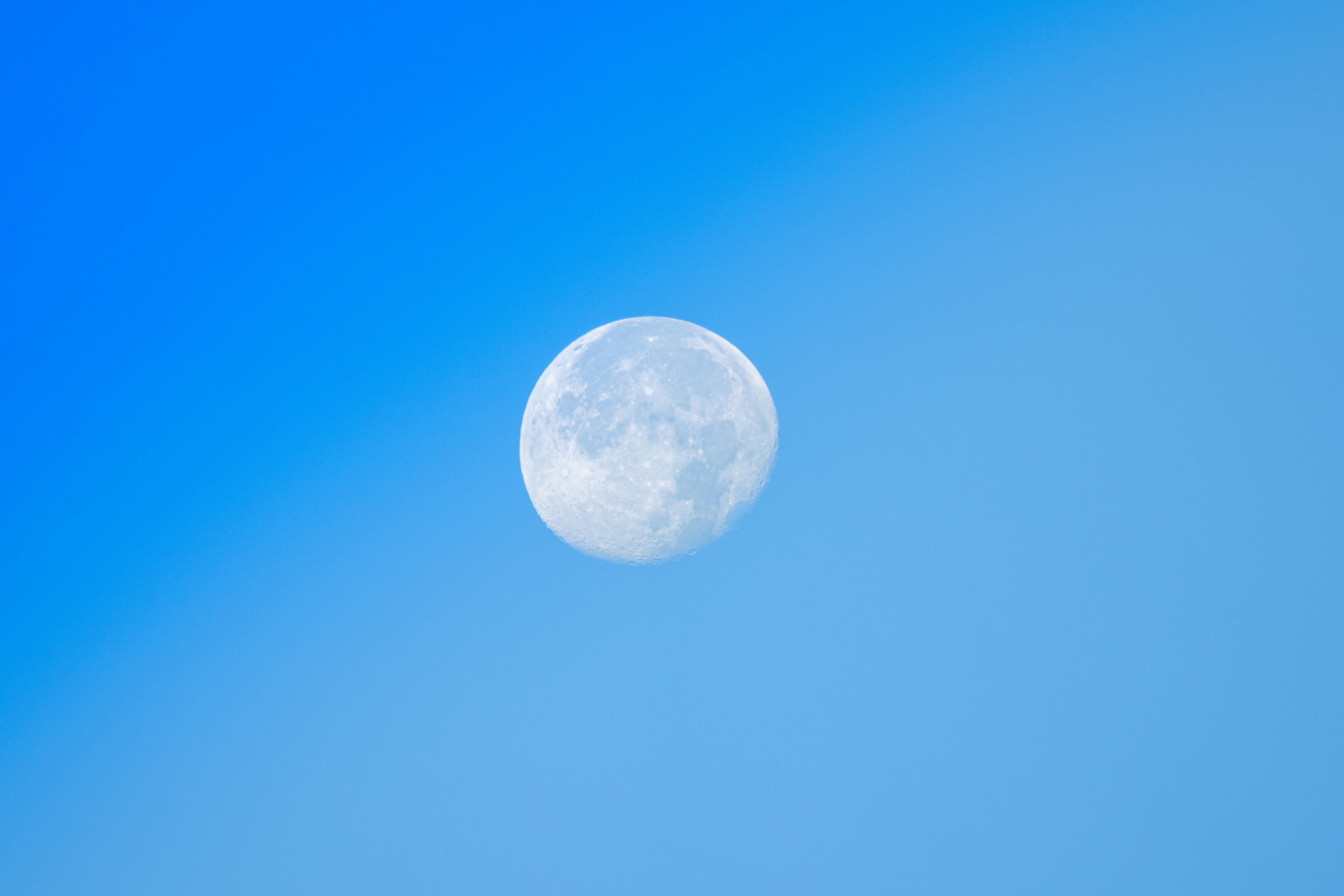 Full Moon in Clear Blue Daytime Sky · Free Stock Photo