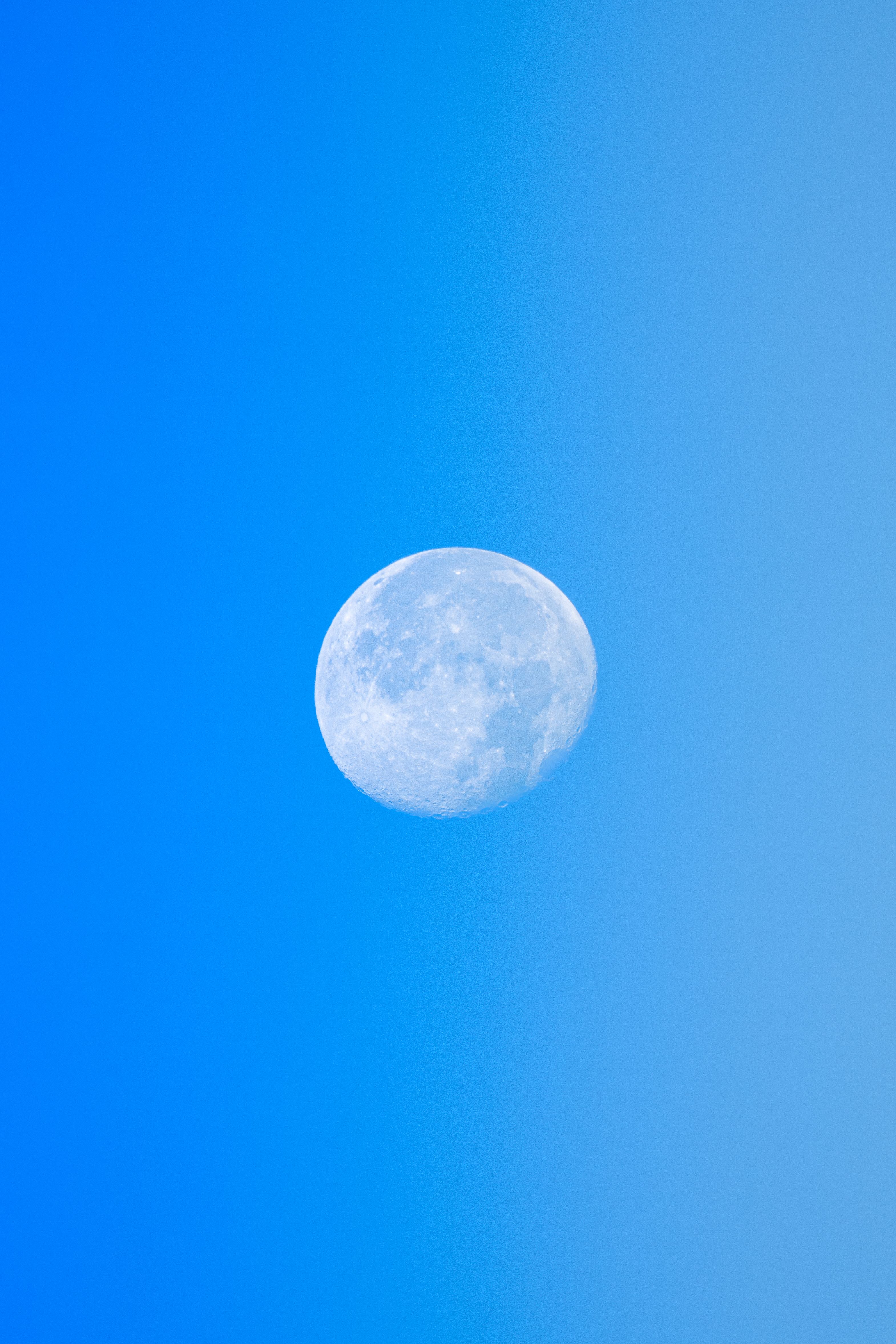 Bright Full Moon Against Blue Sky · Free Stock Photo