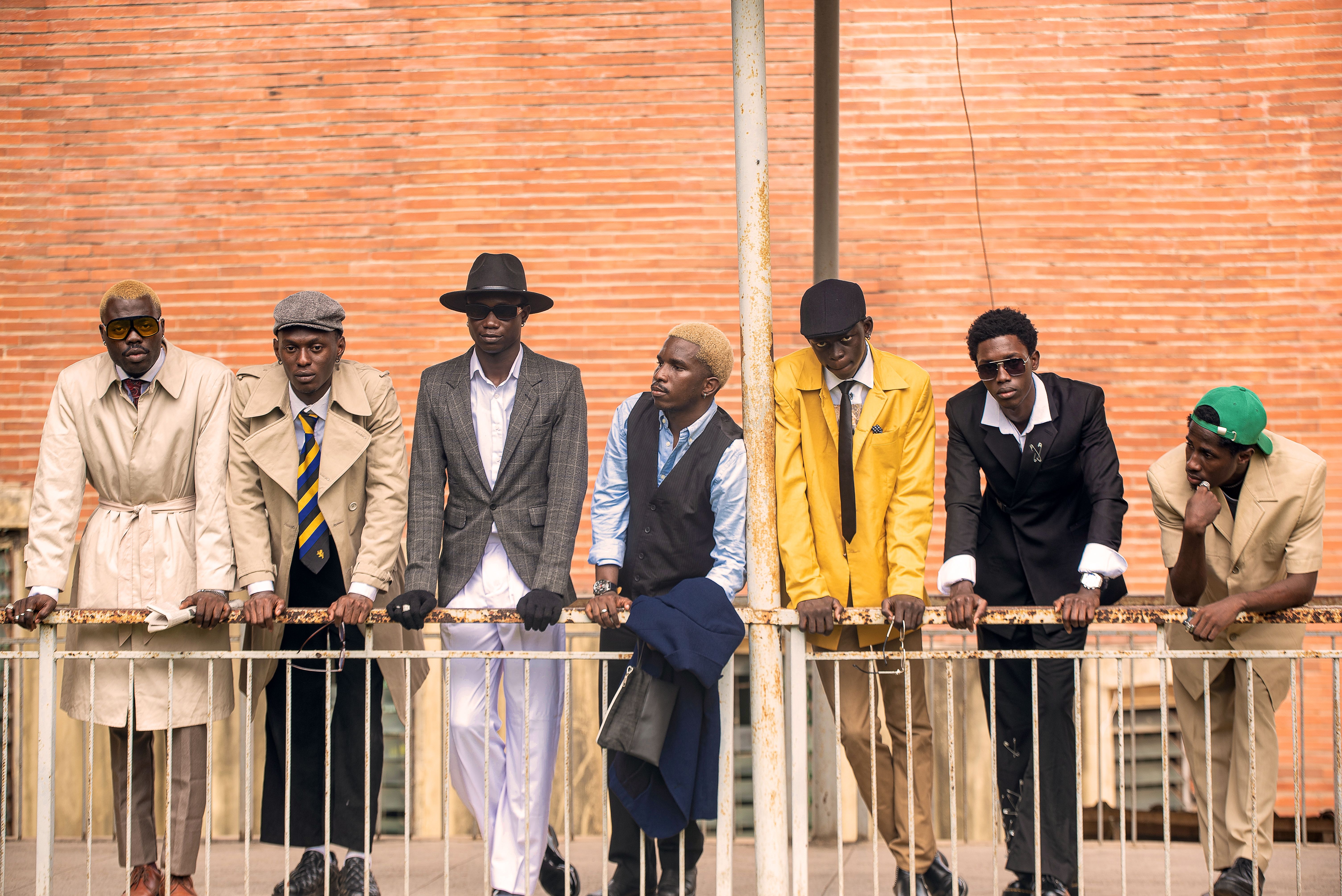 Group of Stylish Men in Vintage Urban Setting · Free Stock Photo