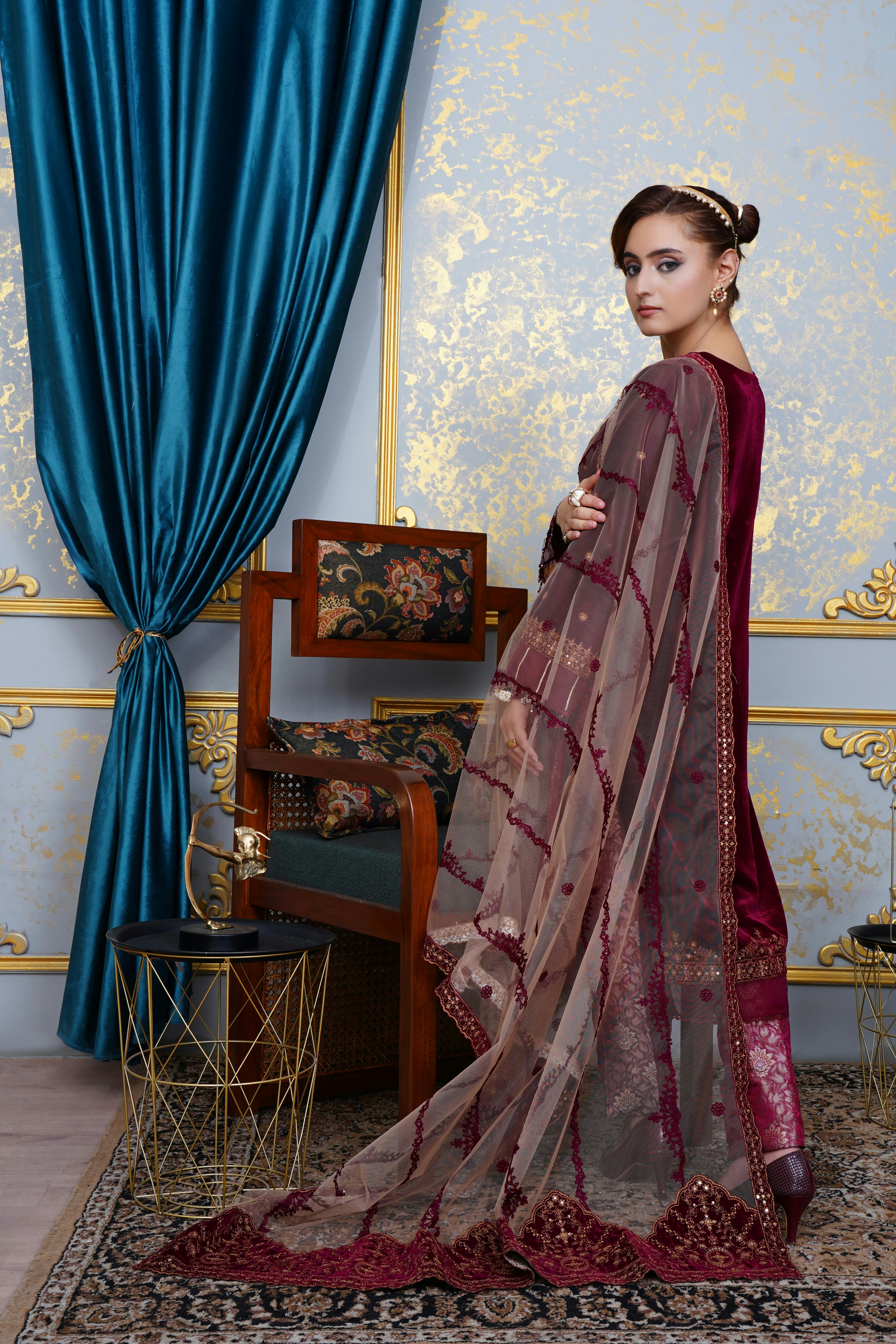 Elegant Fashion Model in Traditional Dress · Free Stock Photo