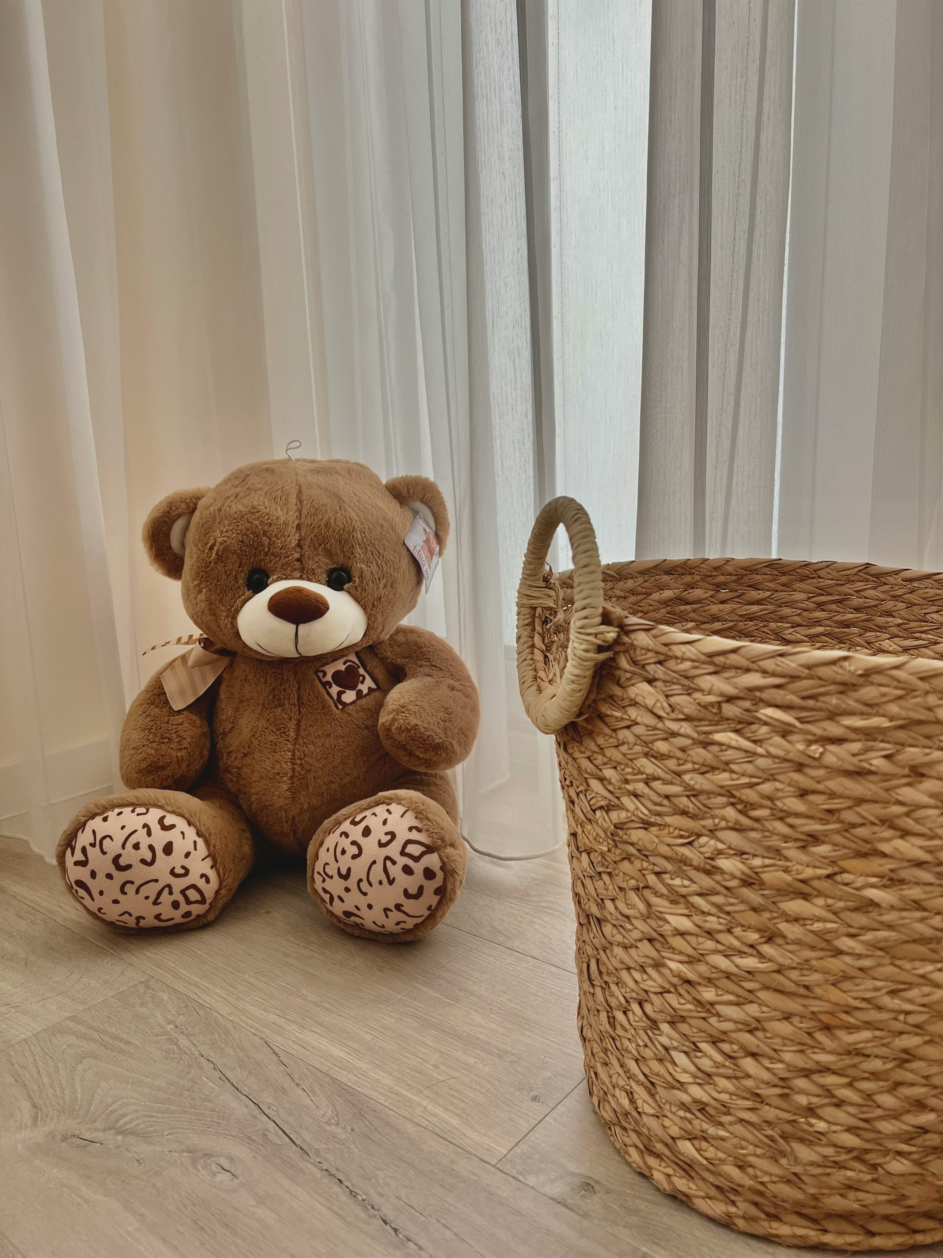 Cozy Teddy Bear in Lighted Room Corner · Free Stock Photo