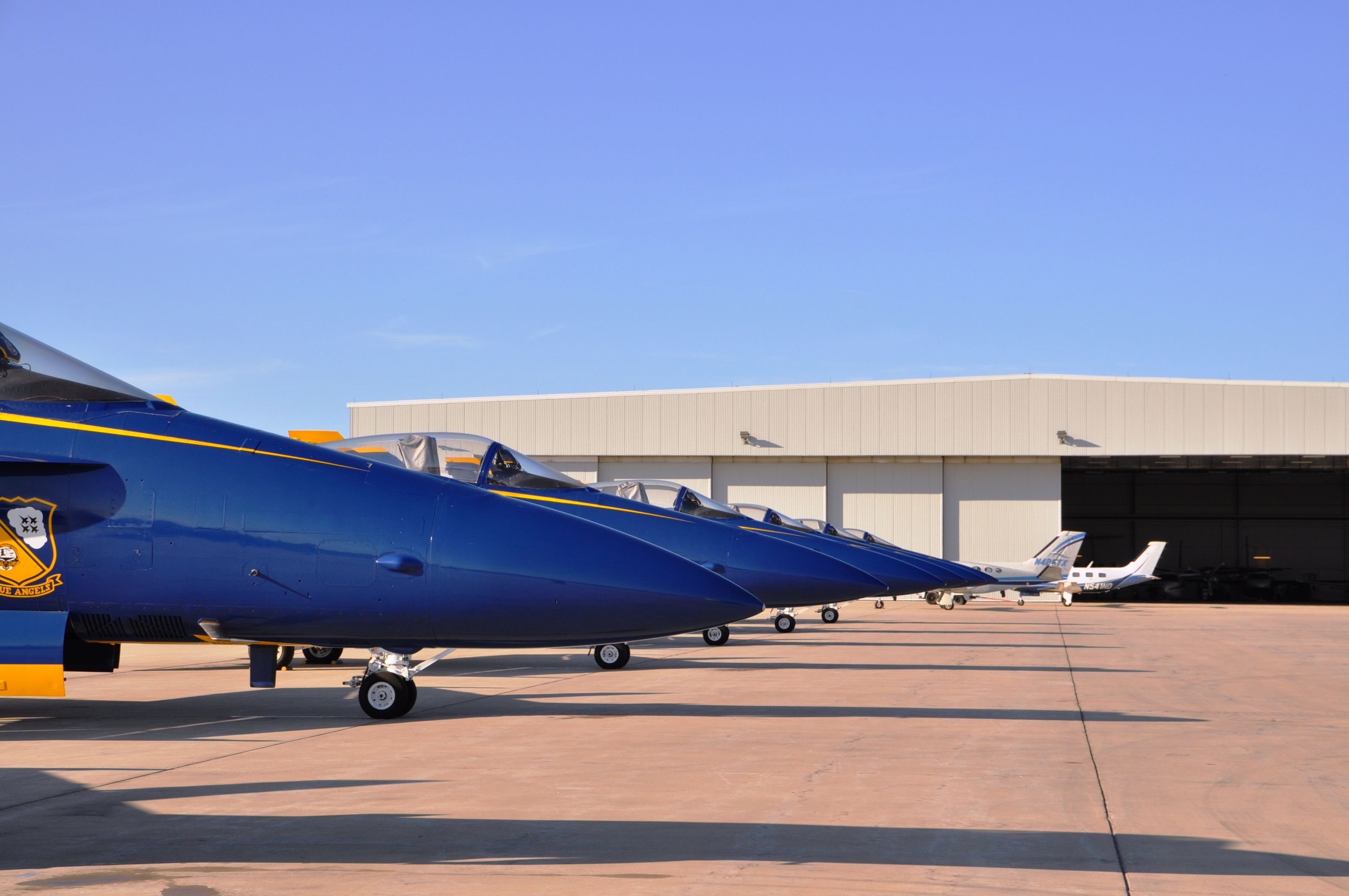 Line of Blue Fighter Jets on Airport Tarmac · Free Stock Photo