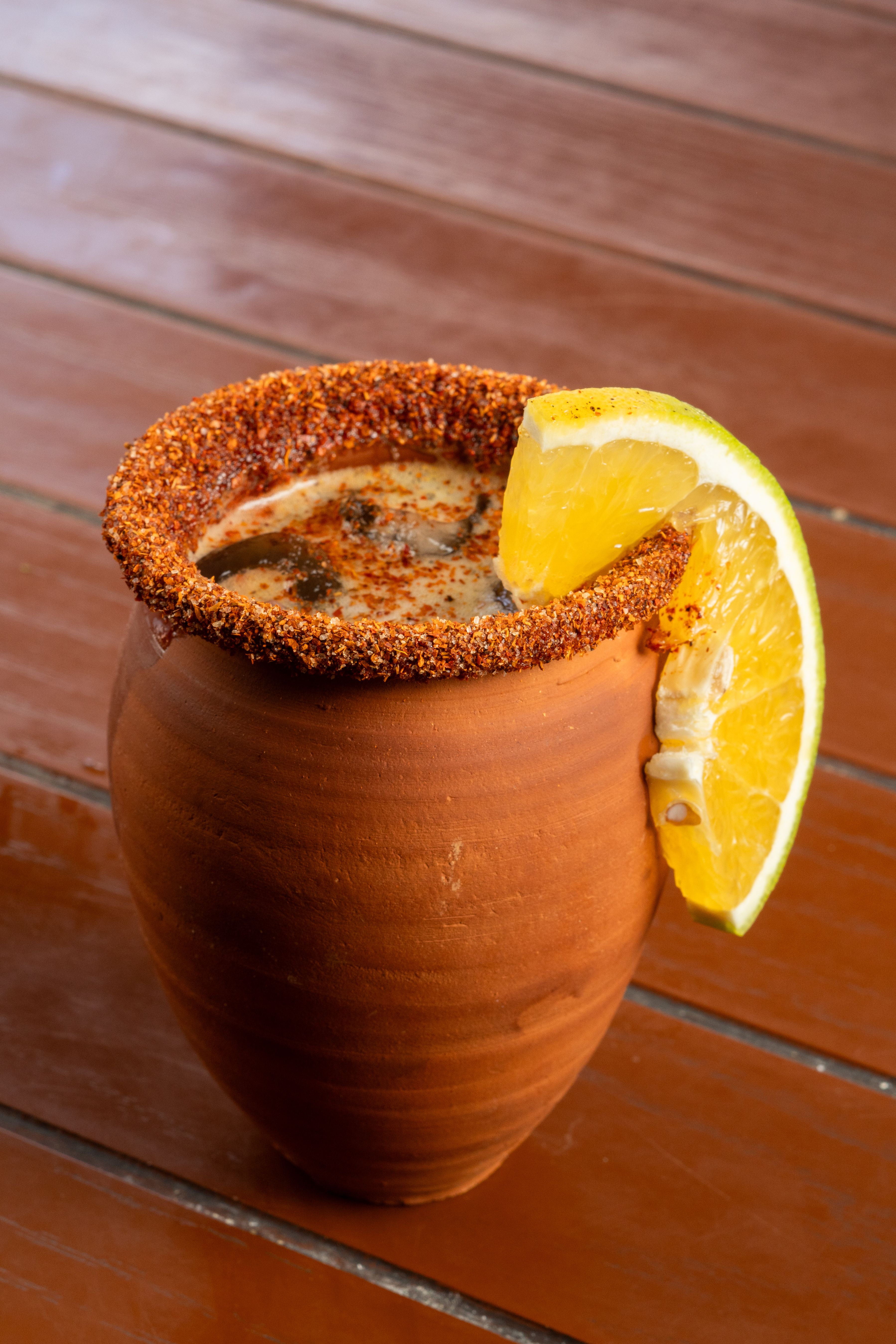 Clay Pot Drink with Orange Slice and Spicy Rim · Free Stock Photo