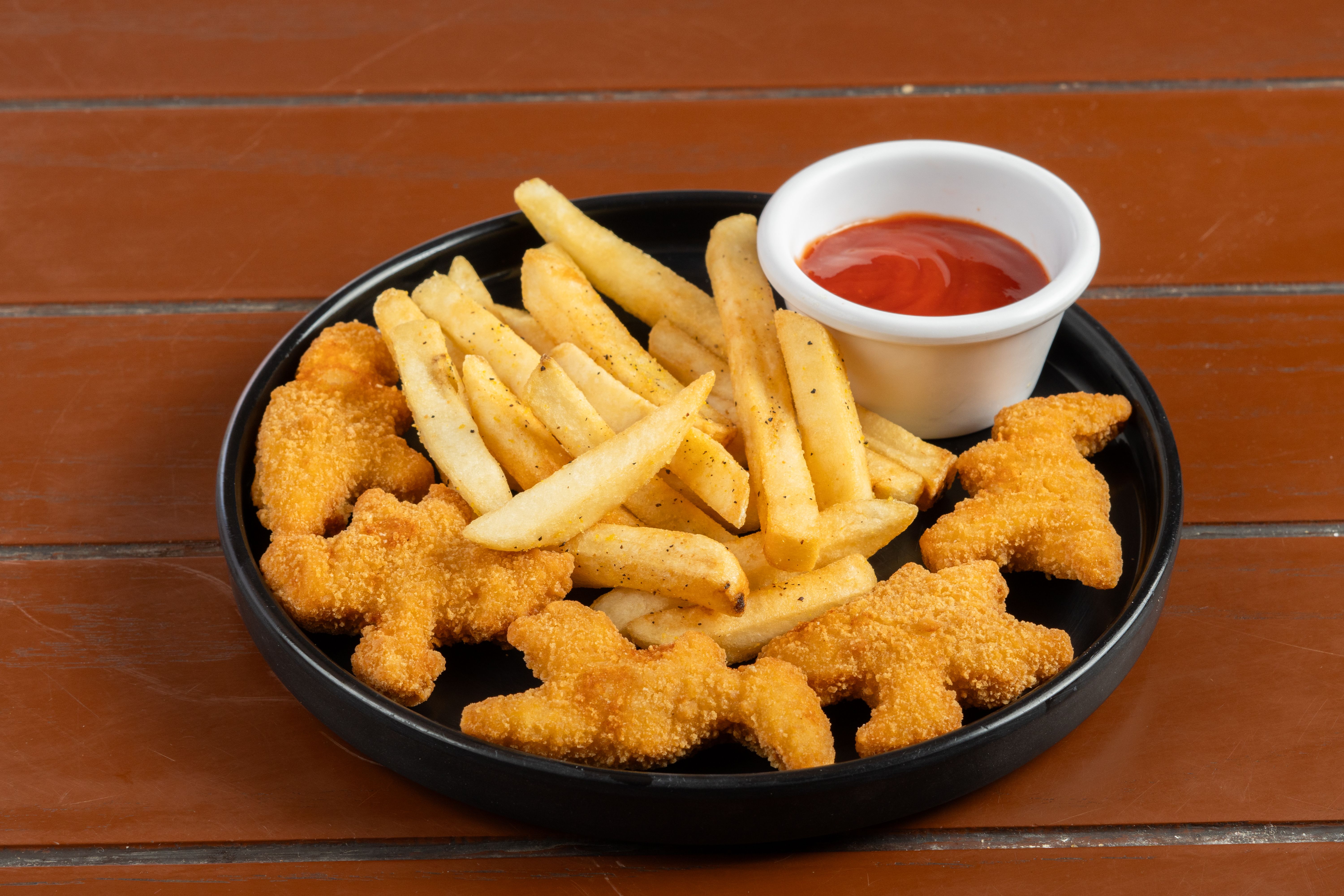 Playful Dinosaur Nuggets with Fries and Ketchup · Free Stock Photo