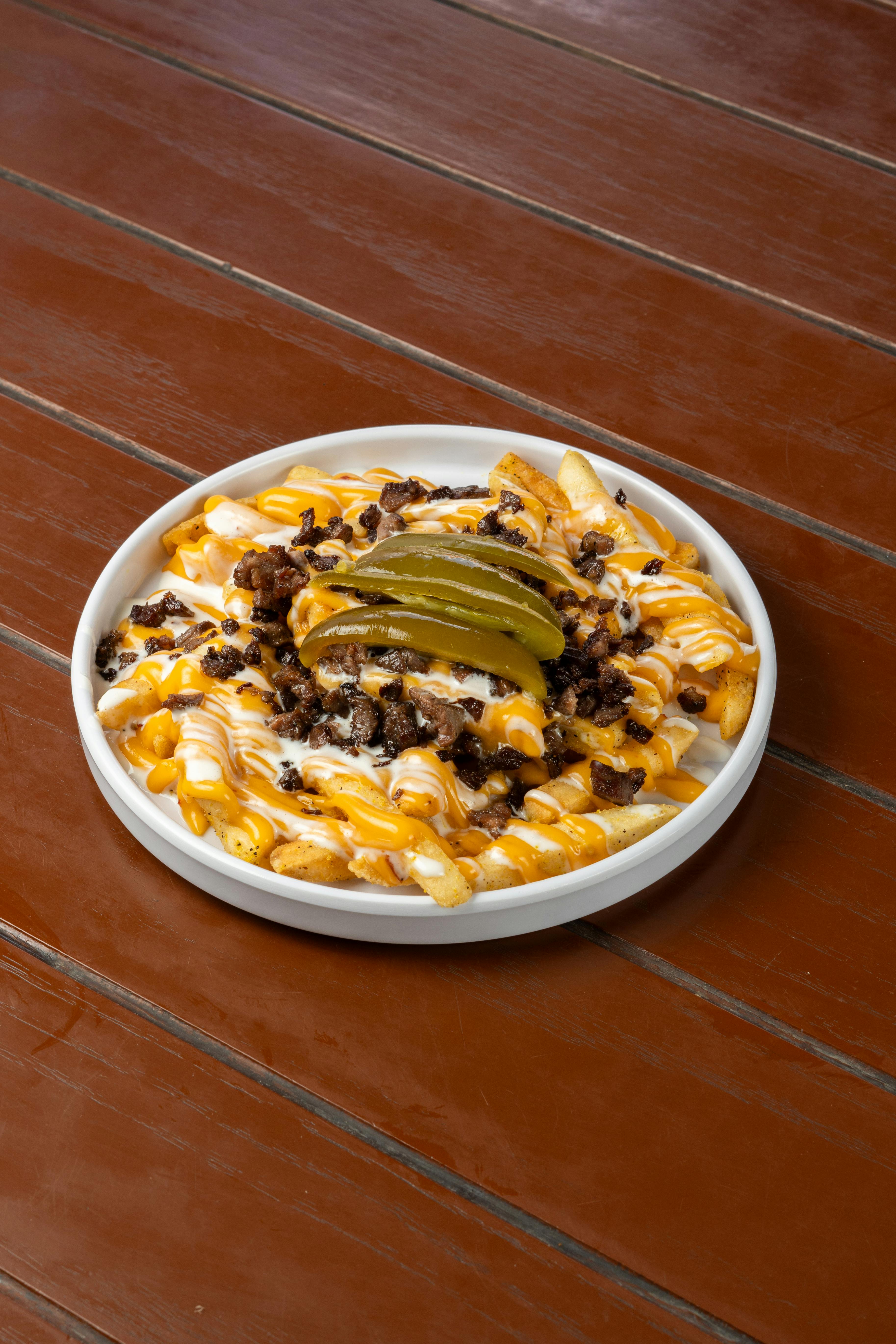 Loaded Cheese Fries with Beef and Pickles · Free Stock Photo