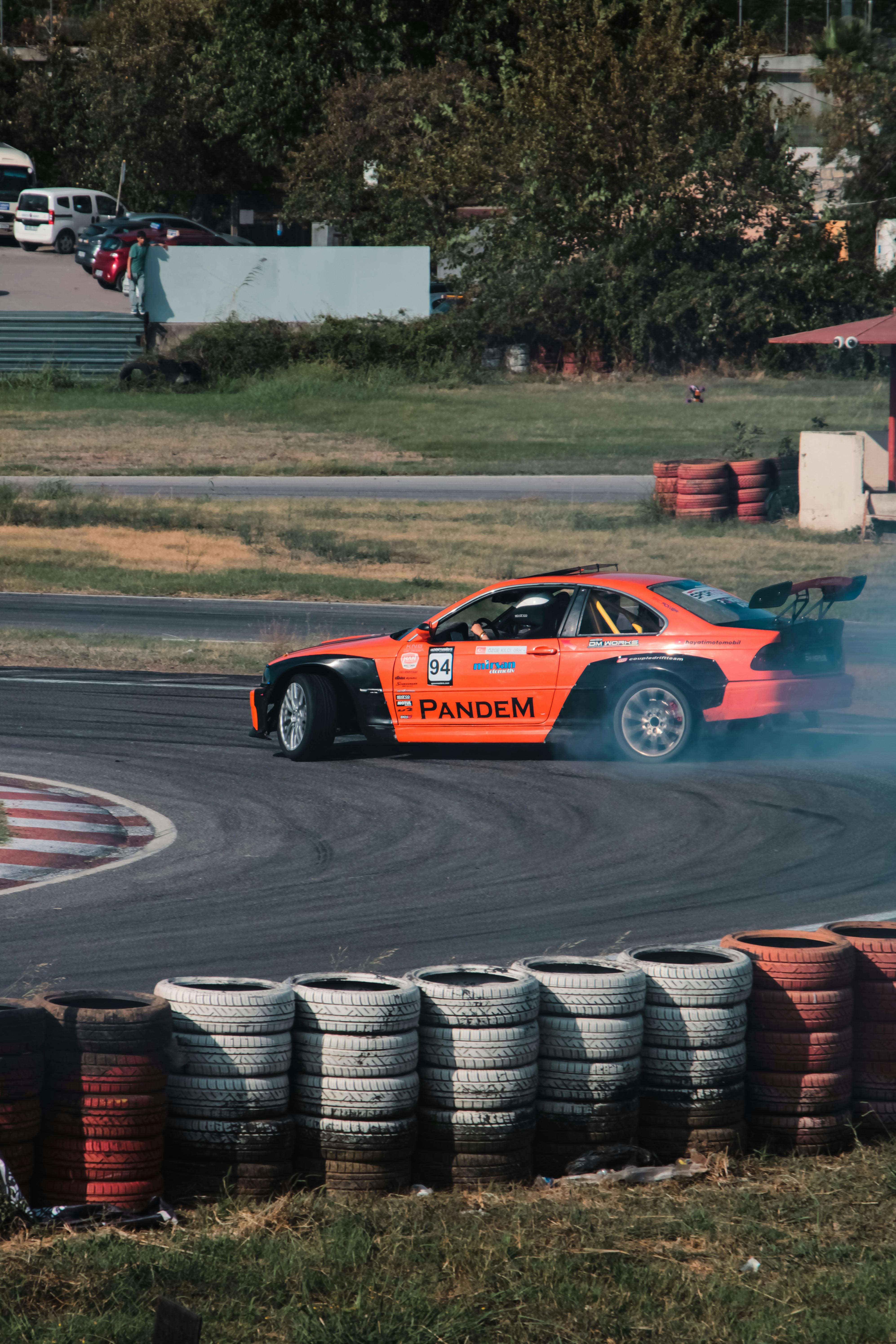 Dynamic Drift Racing Car on Track · Free Stock Photo