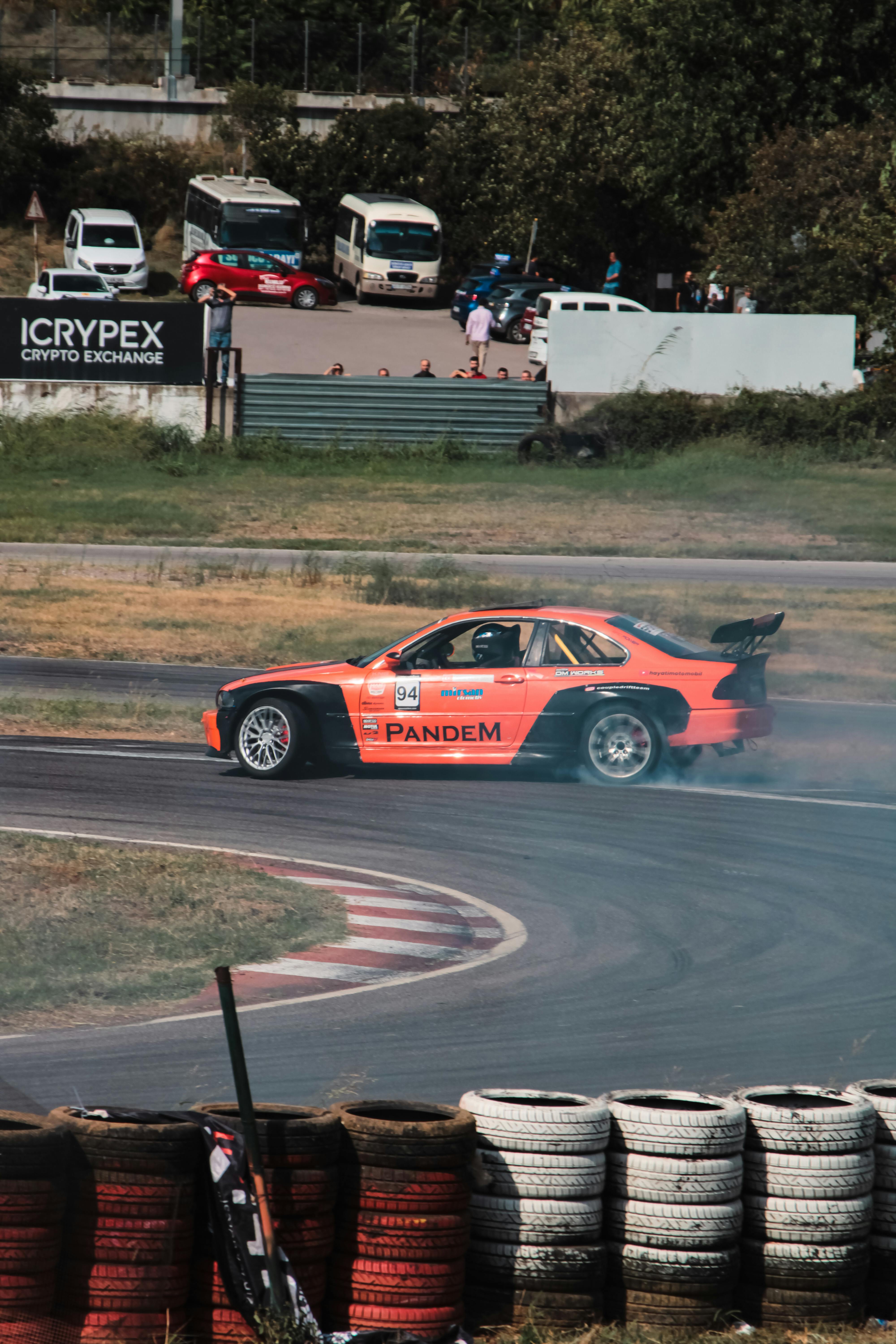 Dynamic car drifting on a race track · Free Stock Photo