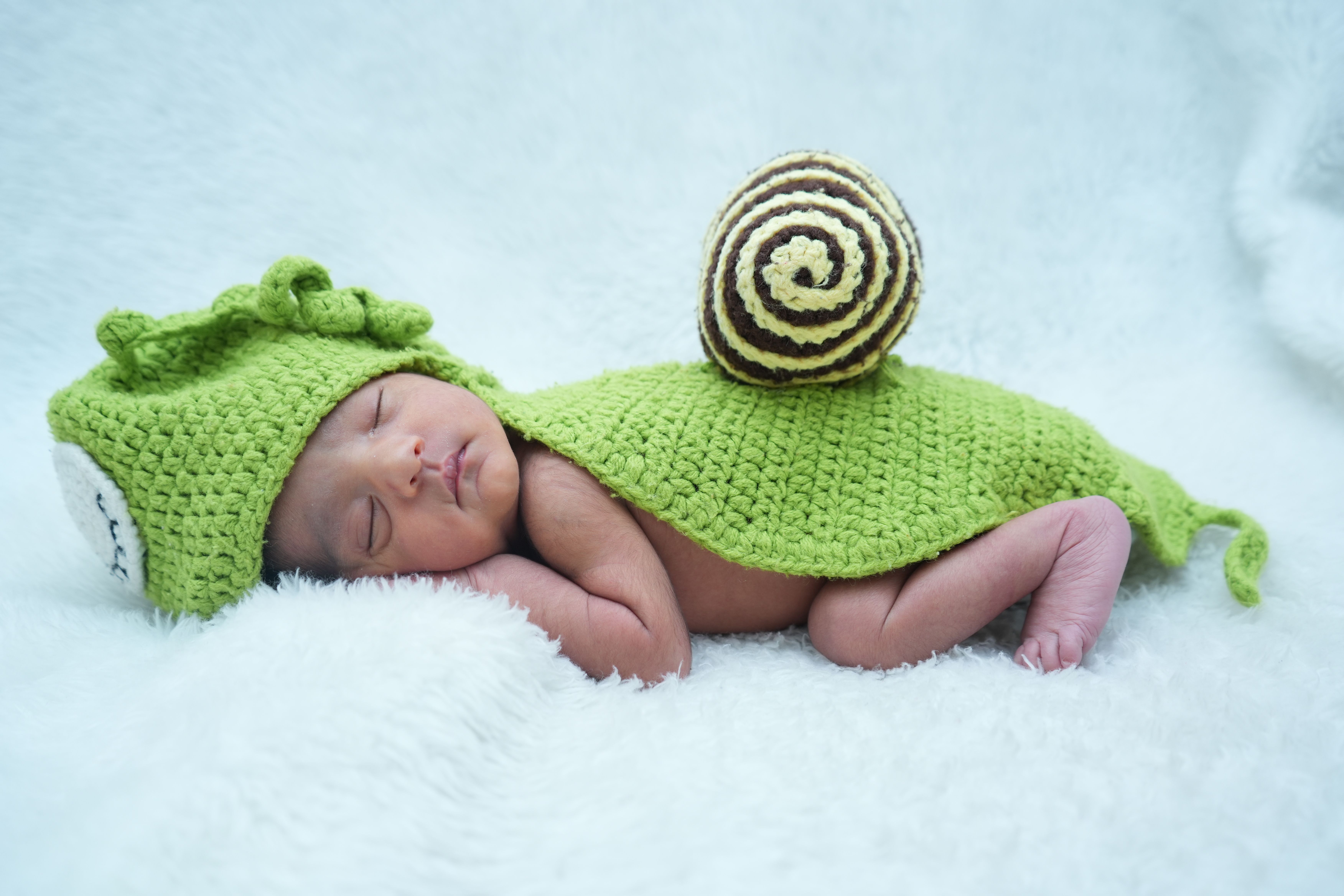 Adorable Baby in Snail Costume Sleeping Peacefully · Free Stock Photo