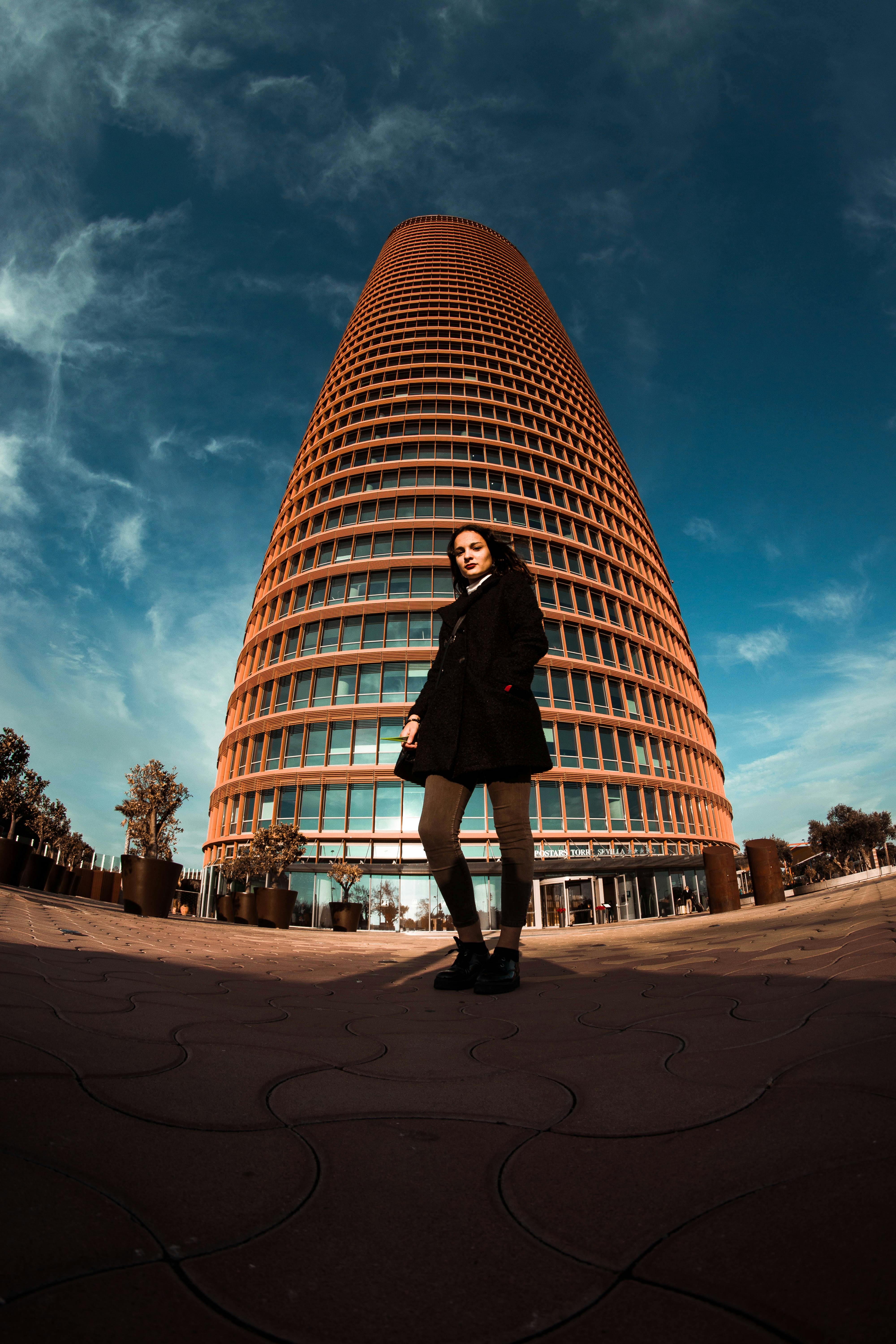 Fish-Eye Photography of Woman Standing in Front of Tall Building · Free ...