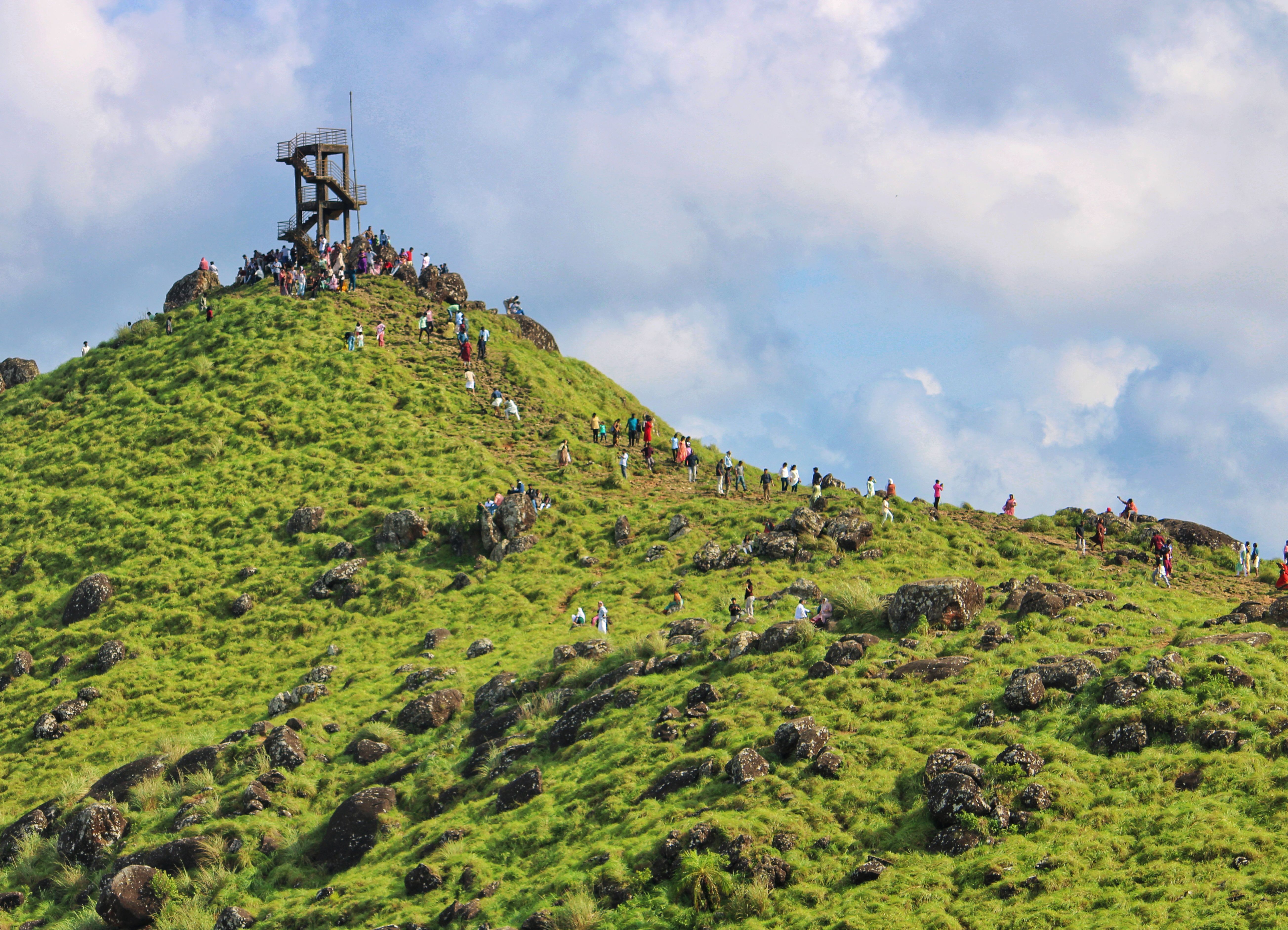 Scenic Hike at Lush Green Hilltop with Observation Deck · Free Stock Photo