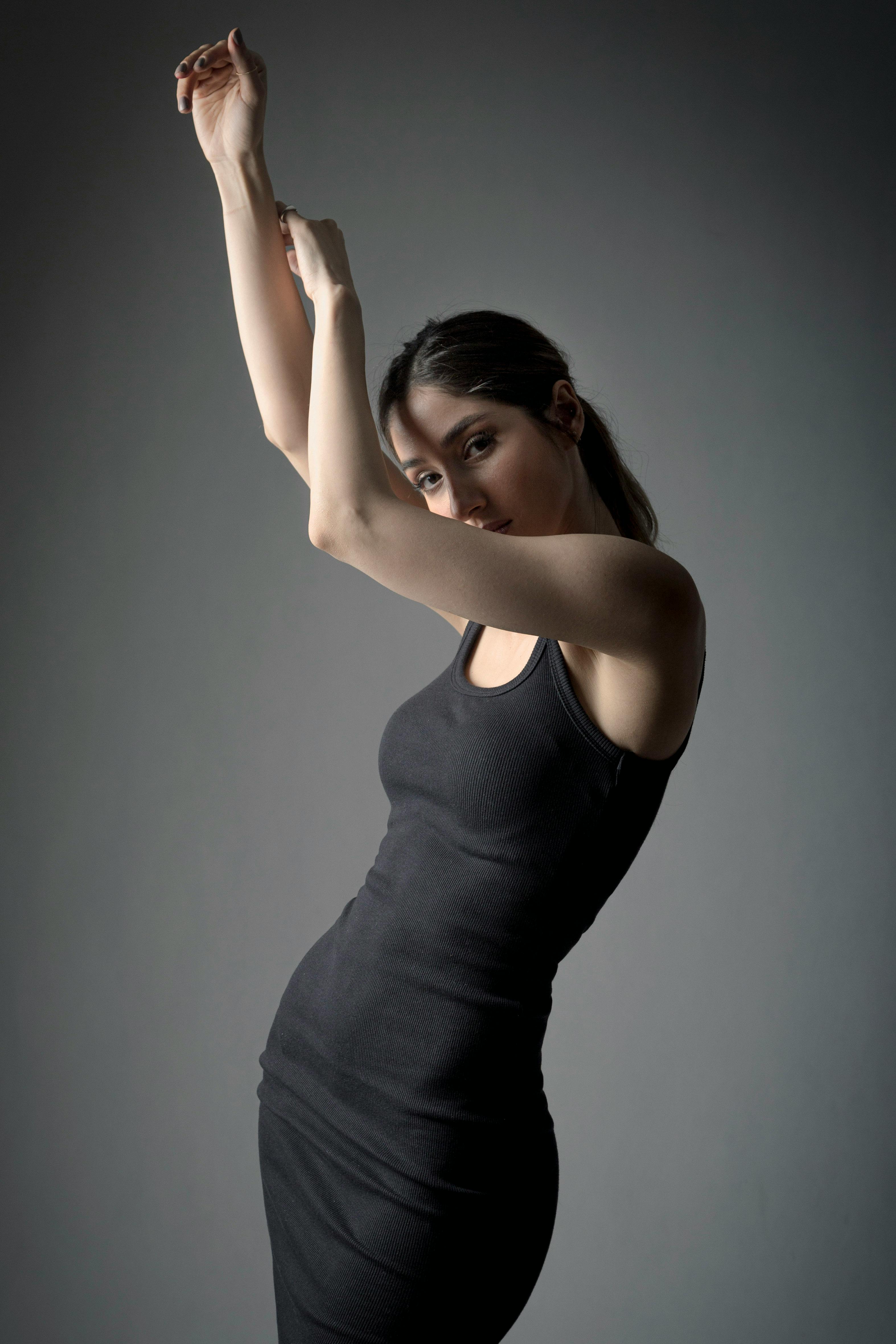 Elegant Woman in Black Dress Posing Dramatically · Free Stock Photo