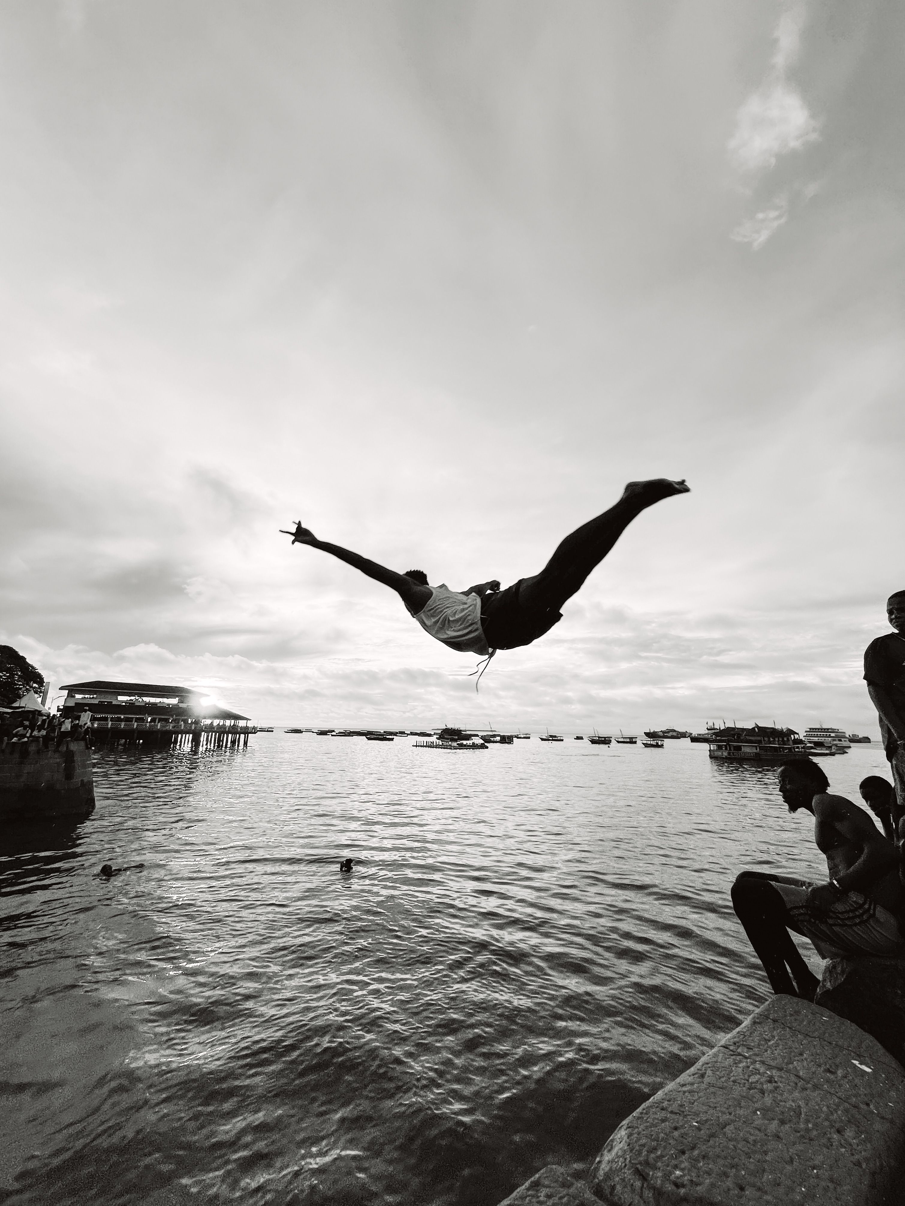 Man Jumping from a Ship to Water · Free Stock Photo