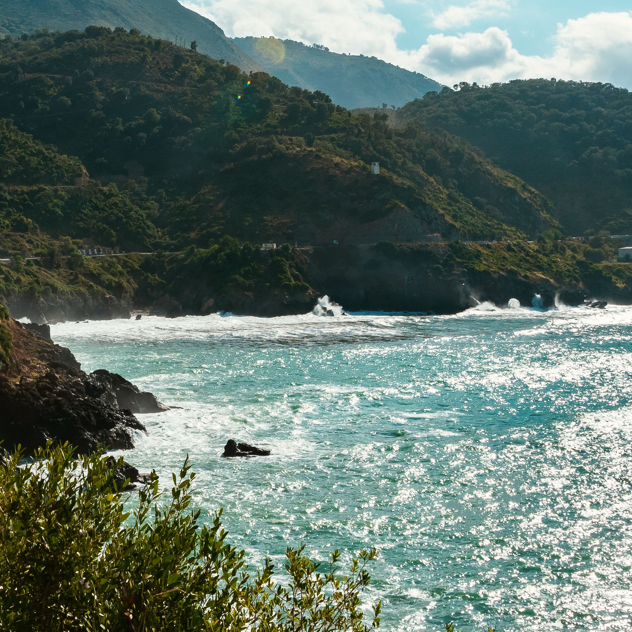 Scenic Coastal Landscape with Lush Green Hills · Free Stock Photo