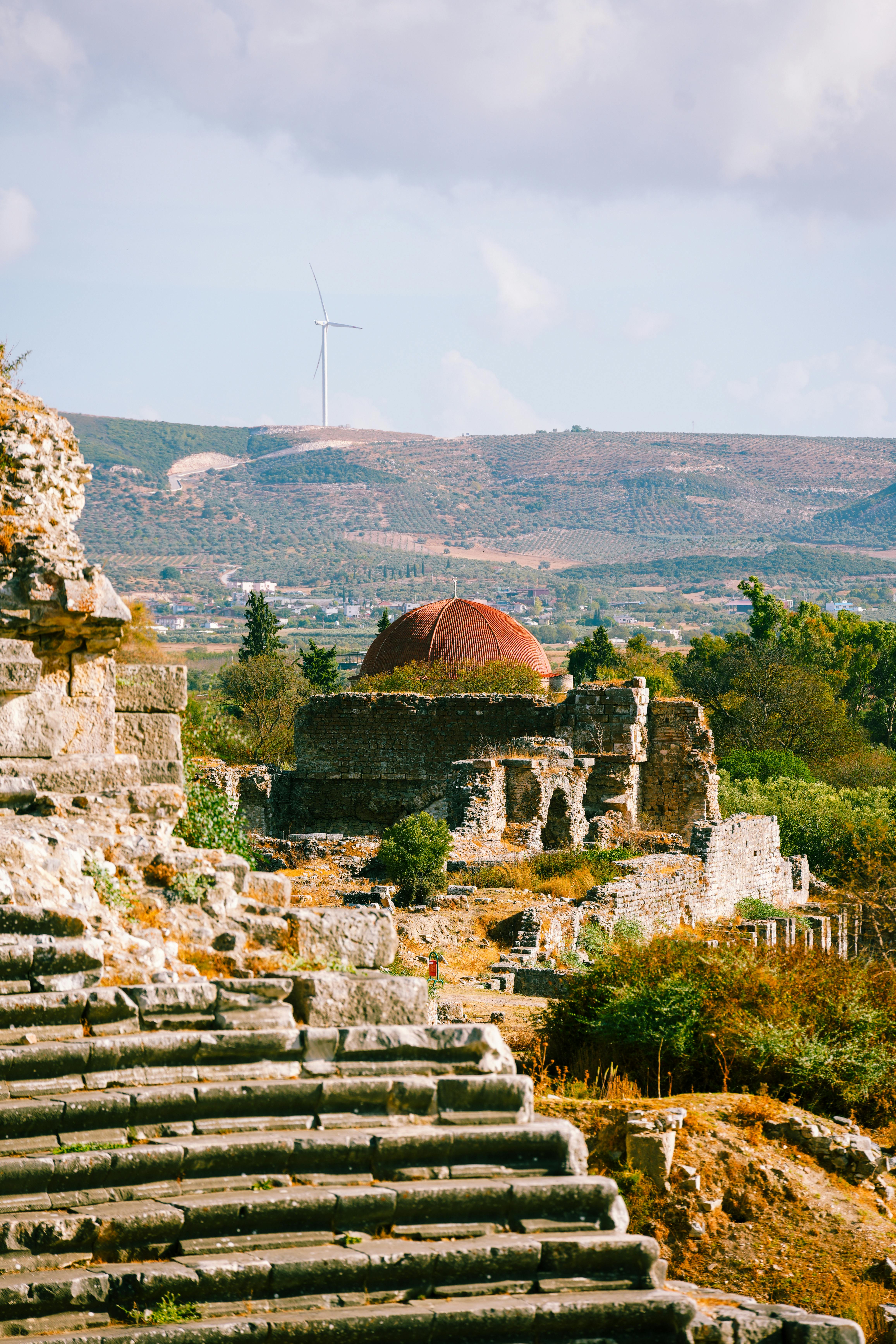 Ancient Ruins and Wind Turbine Landscape View · Free Stock Photo