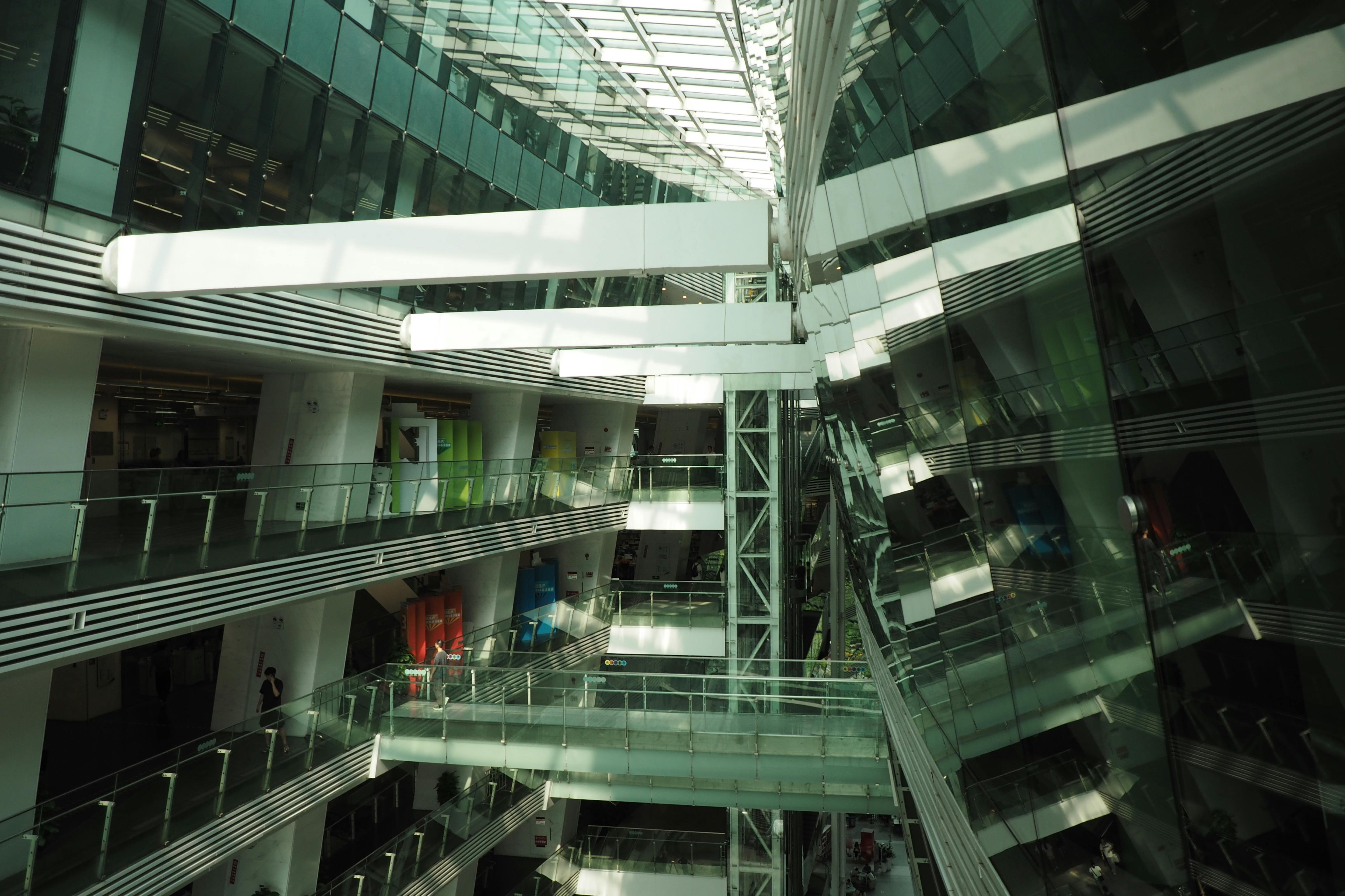 Modern Interior of a Multi-Story Glass Building · Free Stock Photo