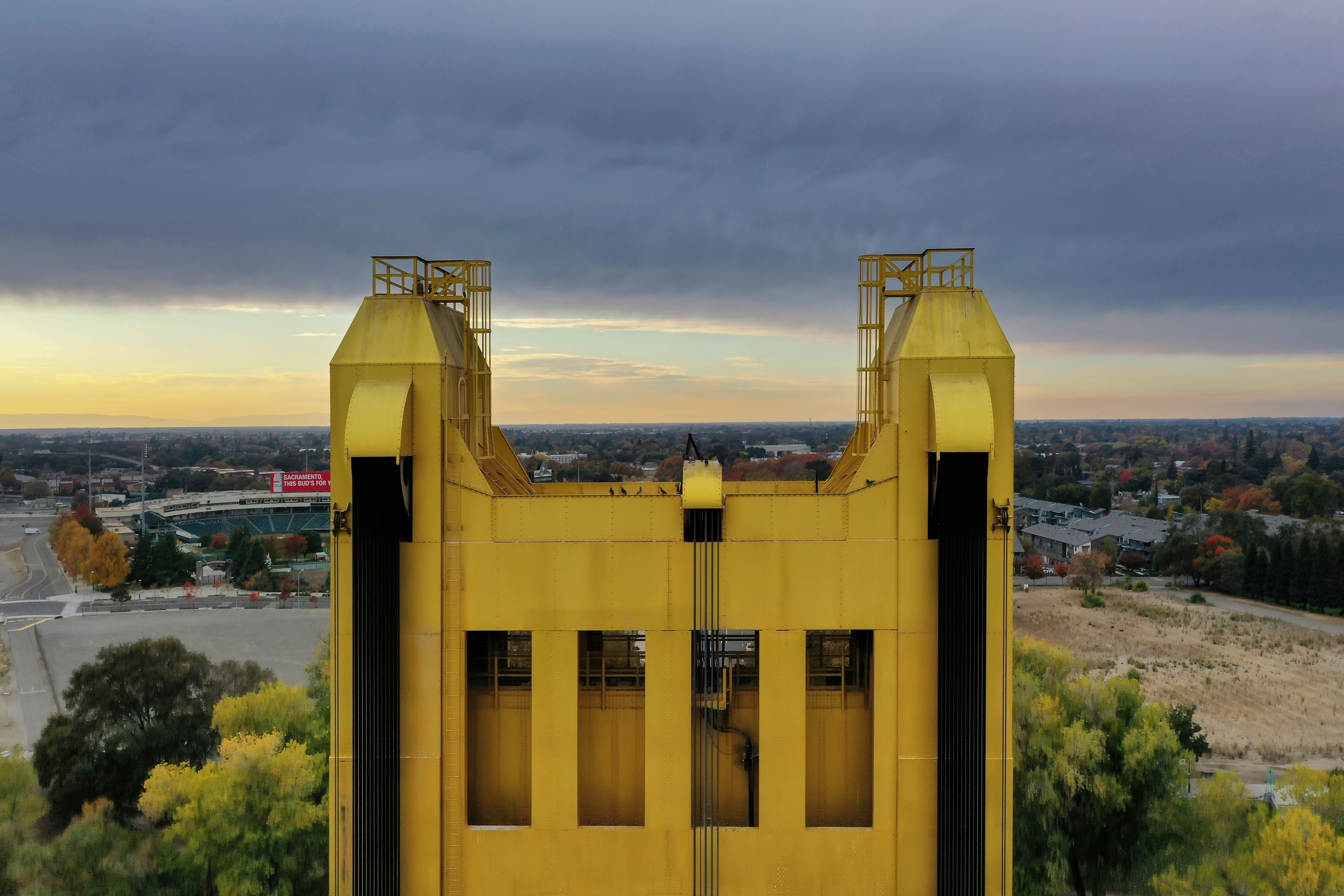 Aerial View of Iconic Yellow Tower at Sunset · Free Stock Photo