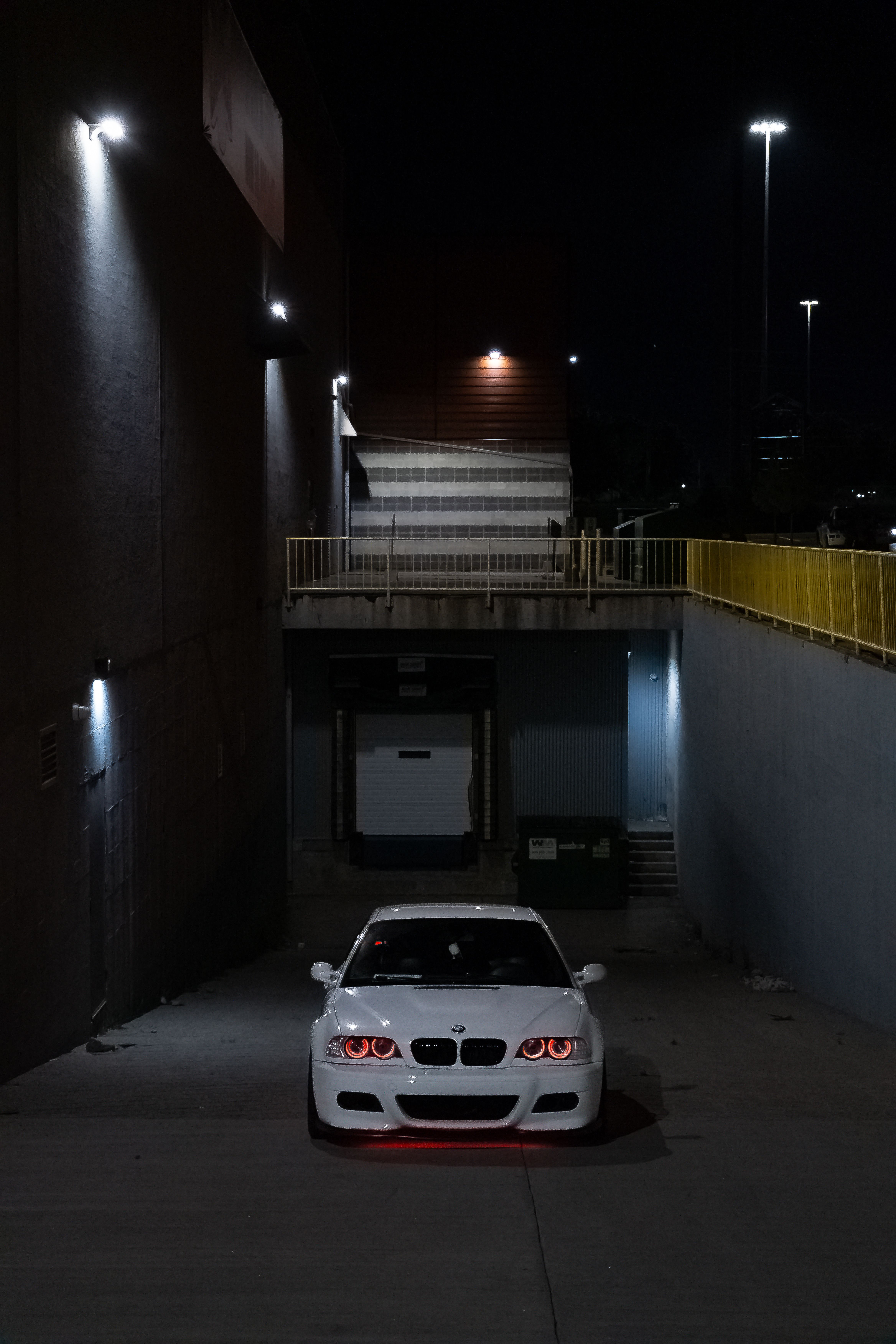 Sleek White Car in Dark Urban Alley at Night · Free Stock Photo